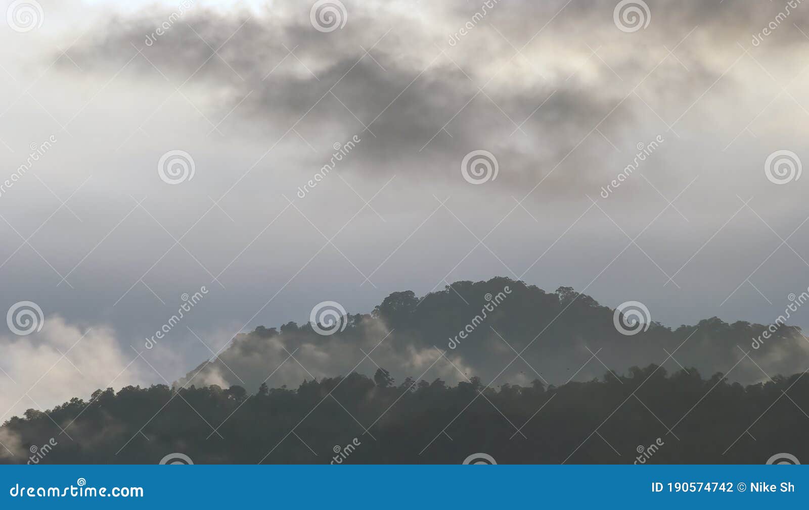 Mist over the hills stock photo. Image of clouds, calm - 190574742