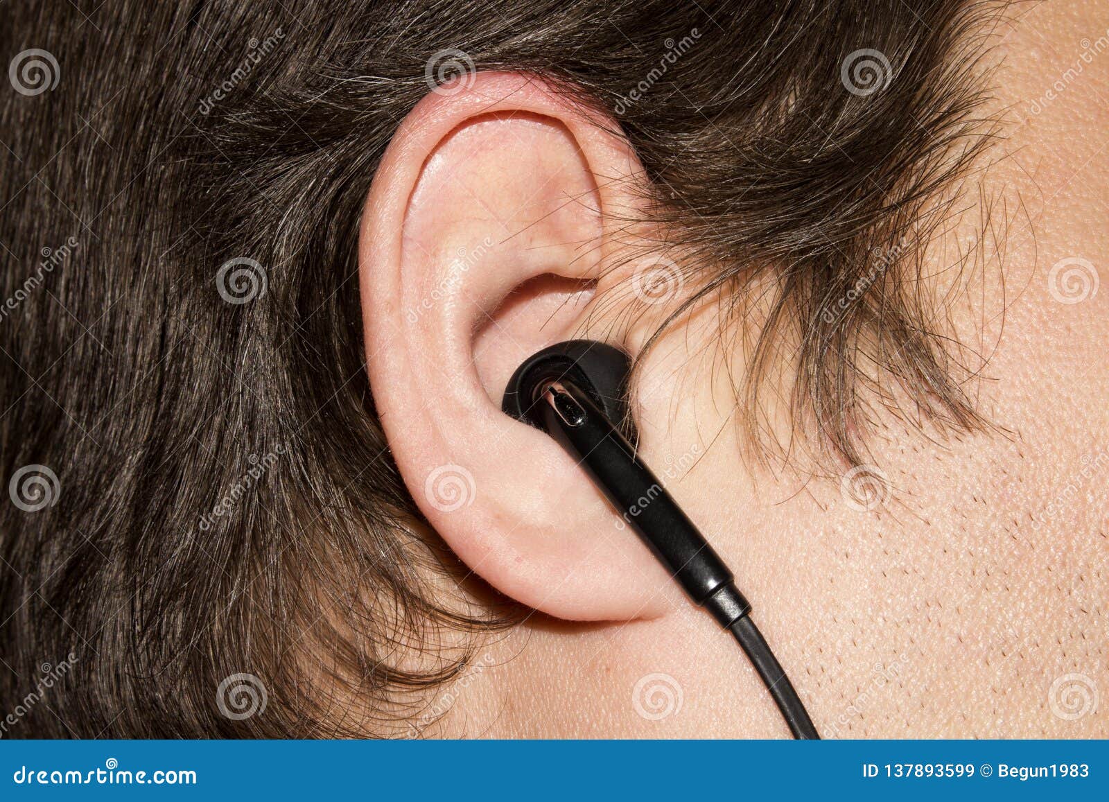 Earpiece in the human ear. stock image. Image of lifestyle - 137893599
