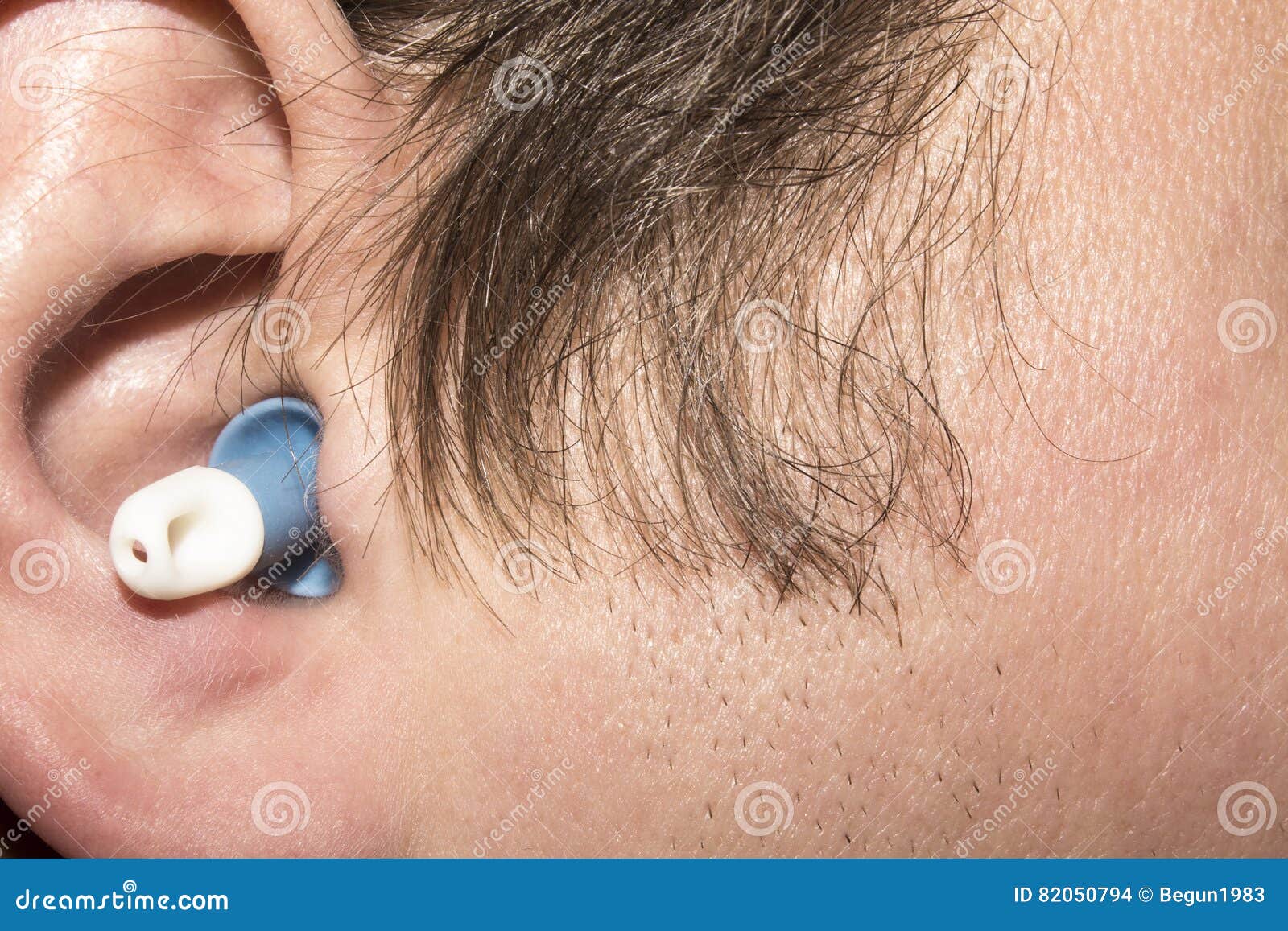 Earplugs Inserted into the Ears of Man Stock Photo - Image of ...
