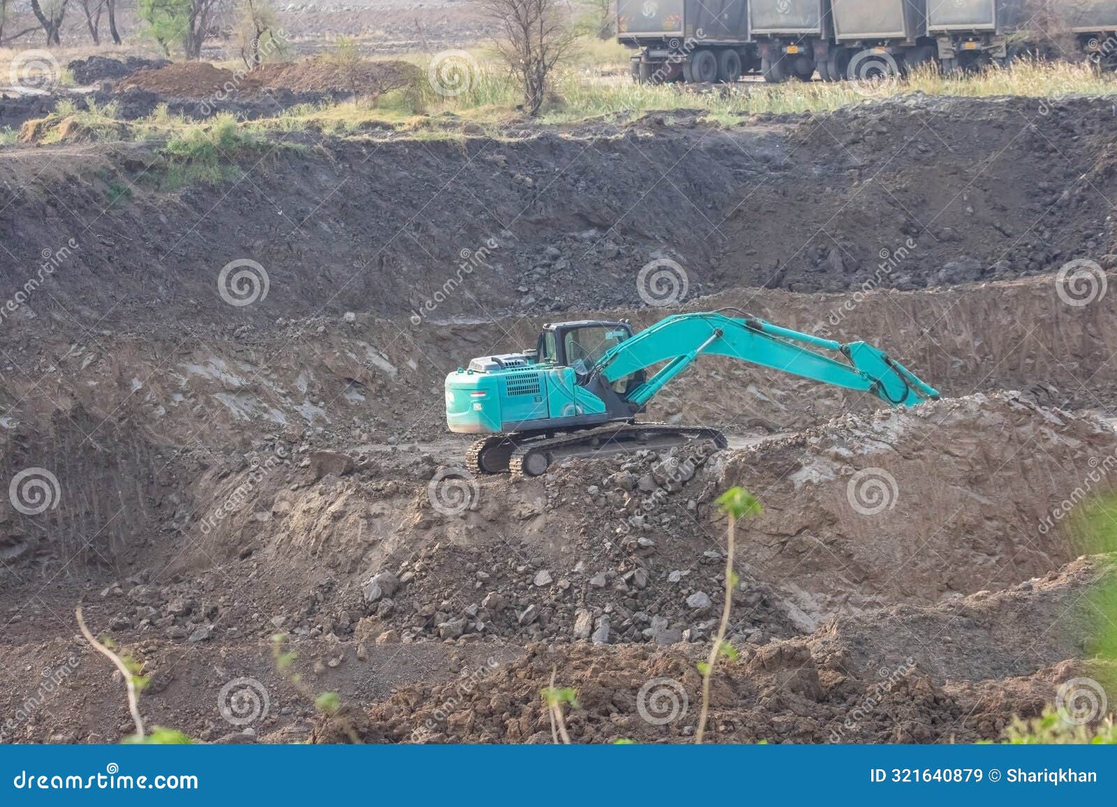 Earth Excavator Digger Loader Machine Digging the Soil at Mining Site ...
