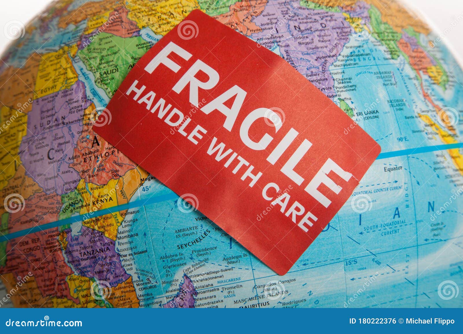 An Earth Globe with a Fragile Hand with Care Sticker Stock Photo ...