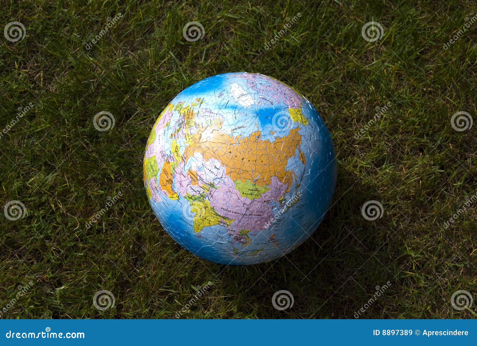Earth globe in the grass stock image. Image of green, field - 8897389