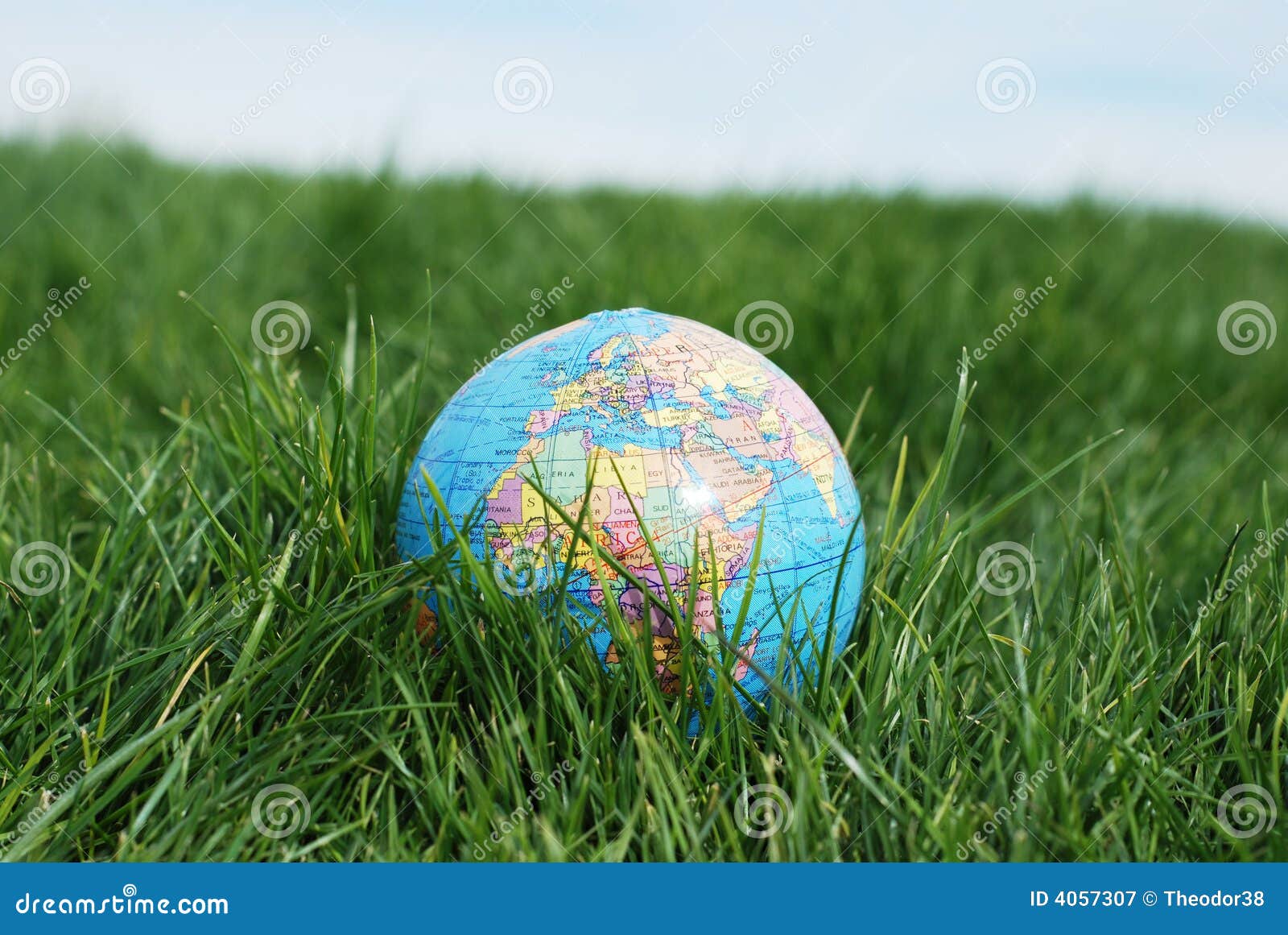 Earth on grass stock image. Image of earth, field, world - 4057307