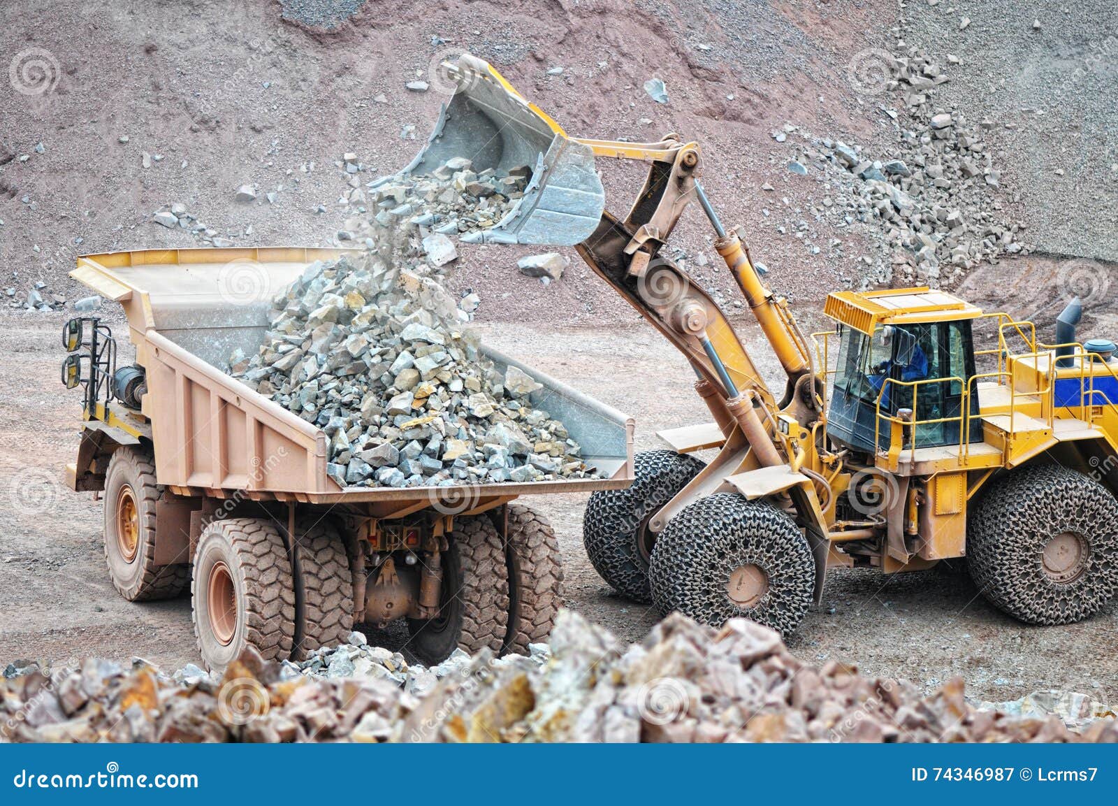 Earth Mover Loading Dumper Truck with Rocks in Quarry Stock Image ...