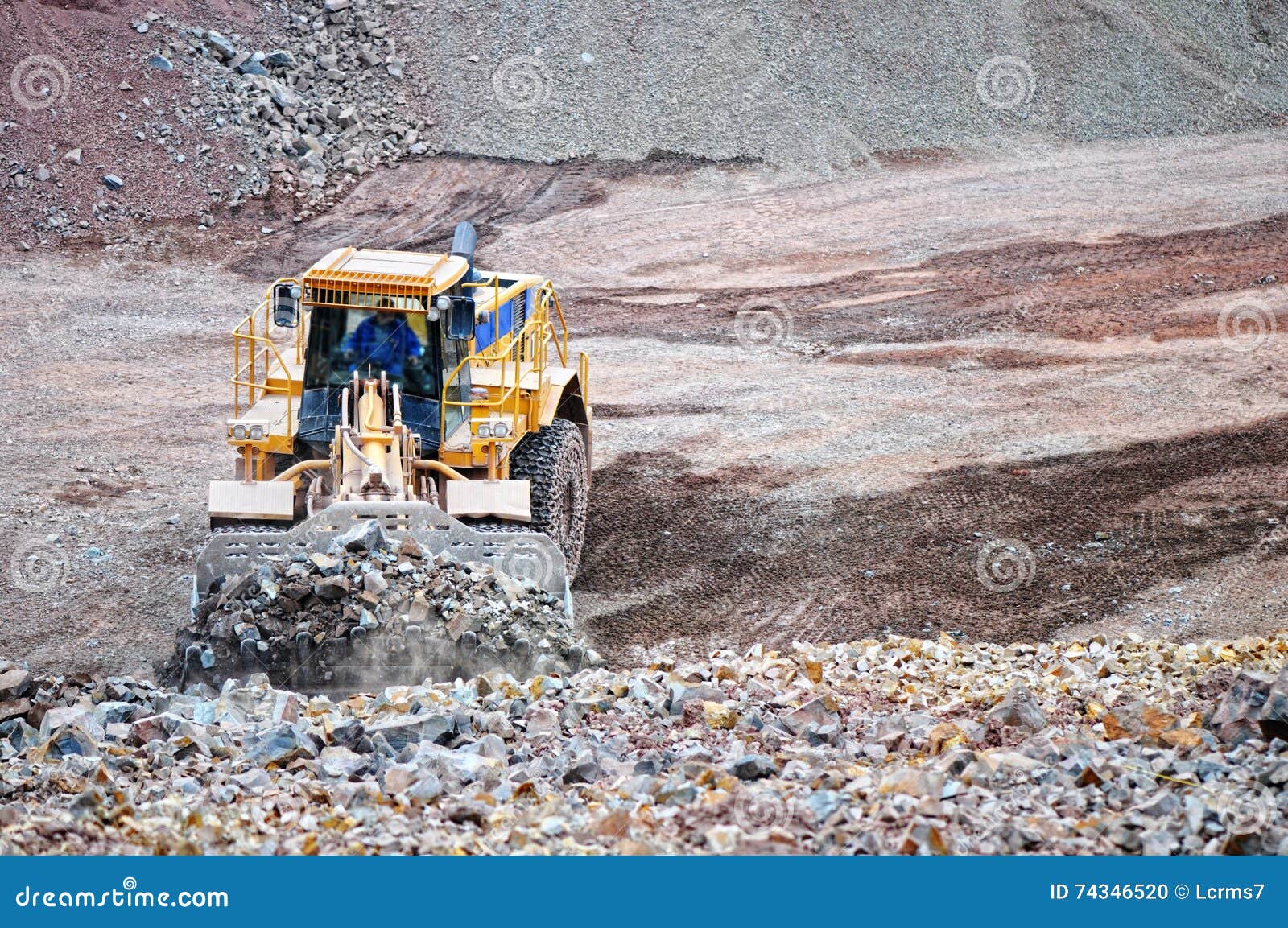 Earth Mover Loading Rocks in a Quarry Stock Photo - Image of phorphyry ...