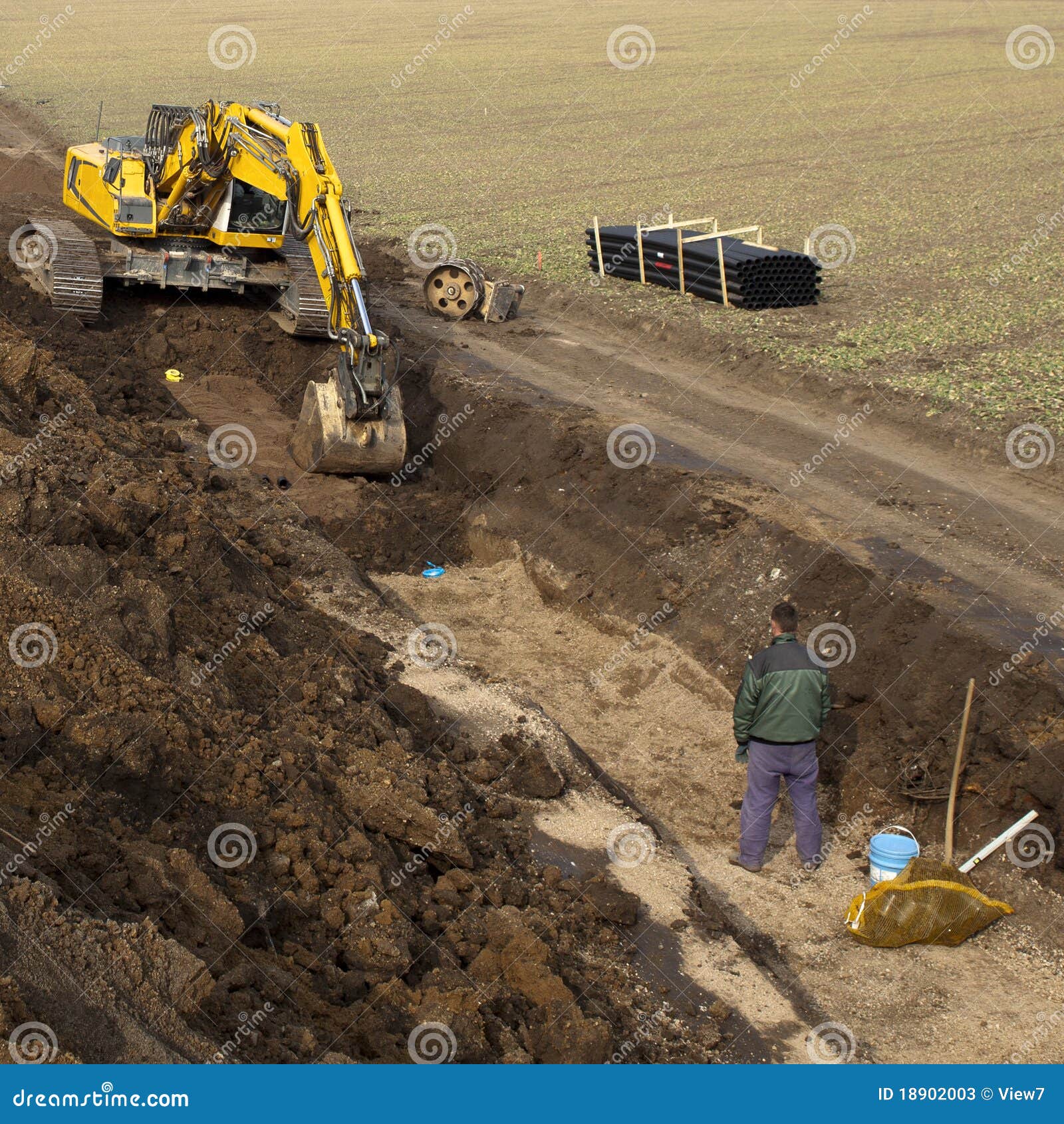 Earth mover and workman stock image. Image of excavating - 18902003