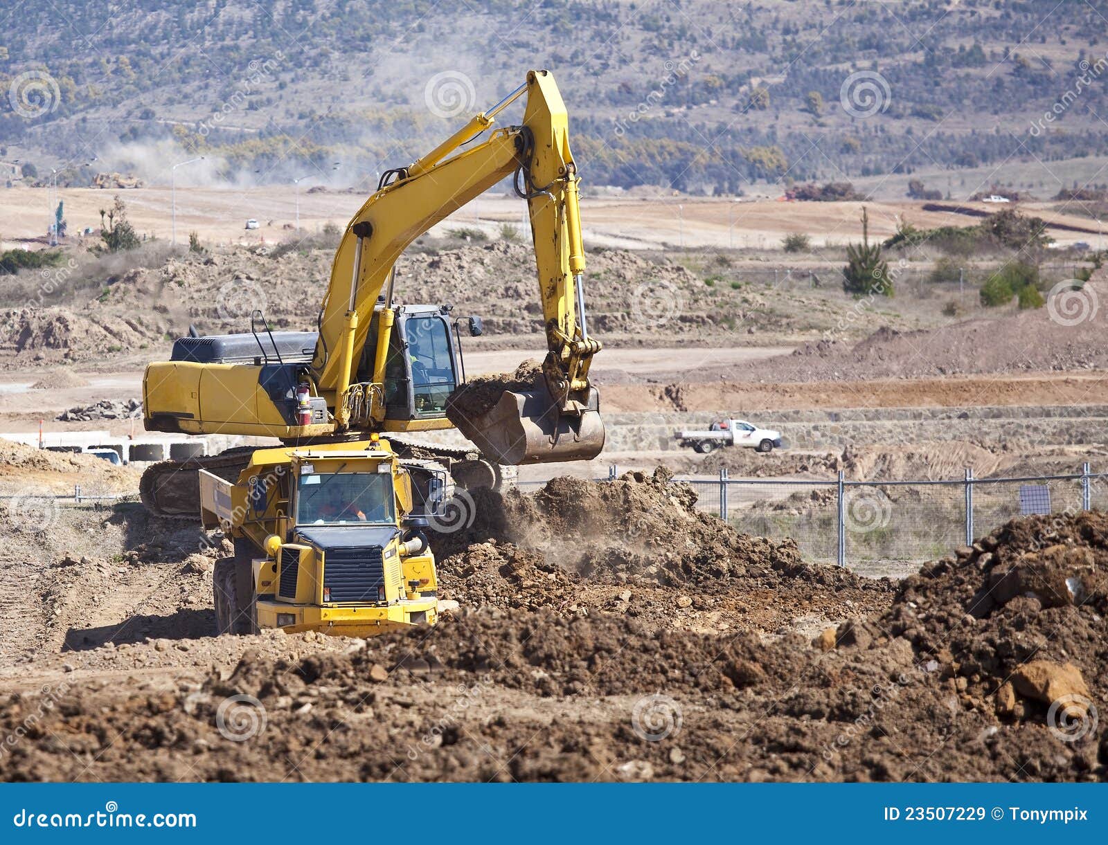 Earth Moving Machine Loading Soil into Truck on Co Stock Image - Image ...