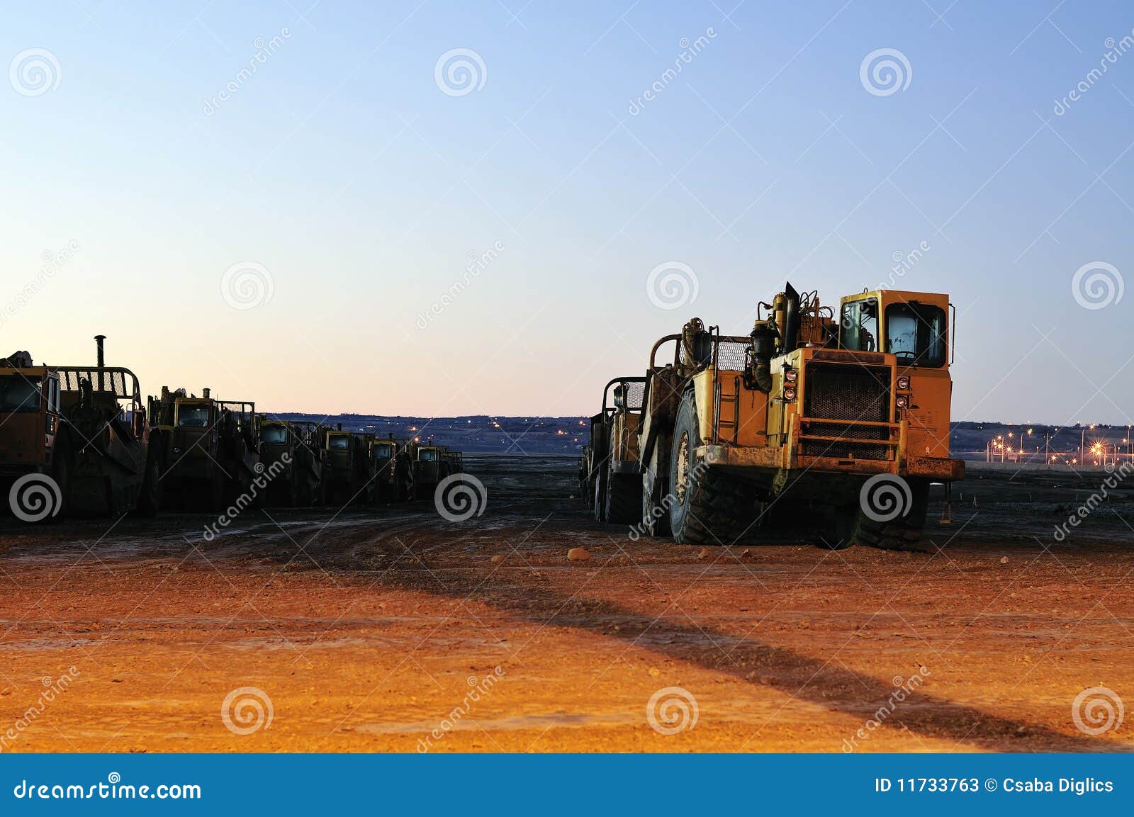 Earth Scrapers stock image. Image of road, earth, machinery - 11733763