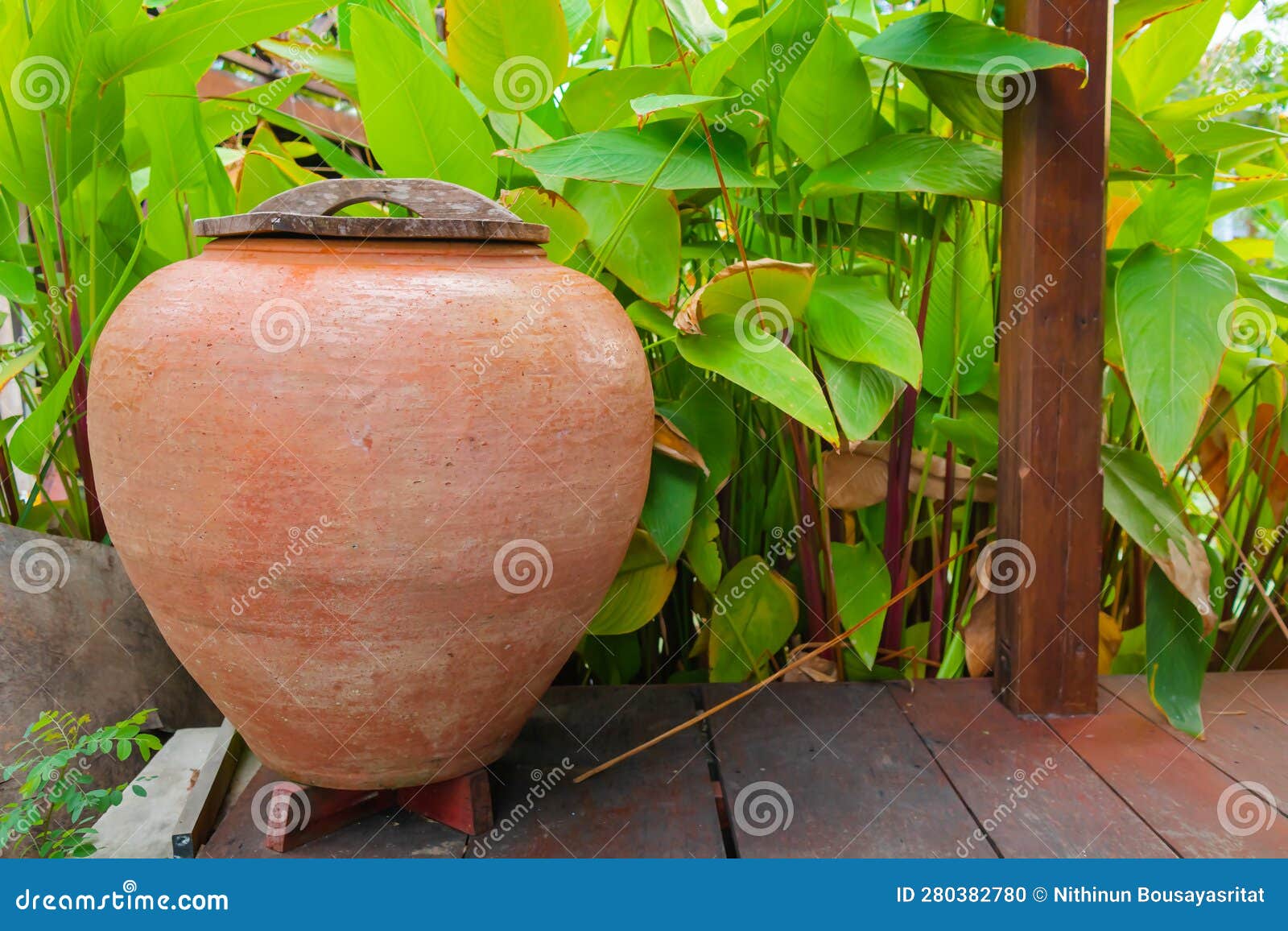 Earthen Jar on Wooden Terrace Stock Photo - Image of orange, design ...