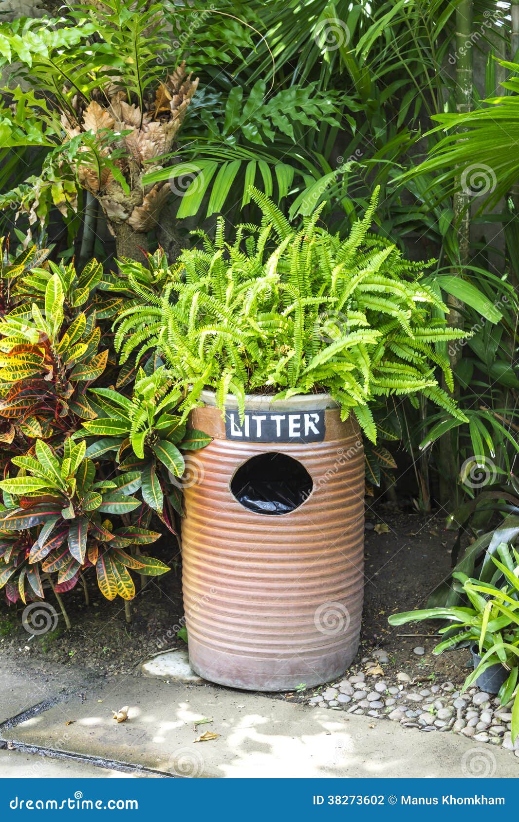 Earthenware Litter Bin with Green Plant Stock Photo - Image of ...