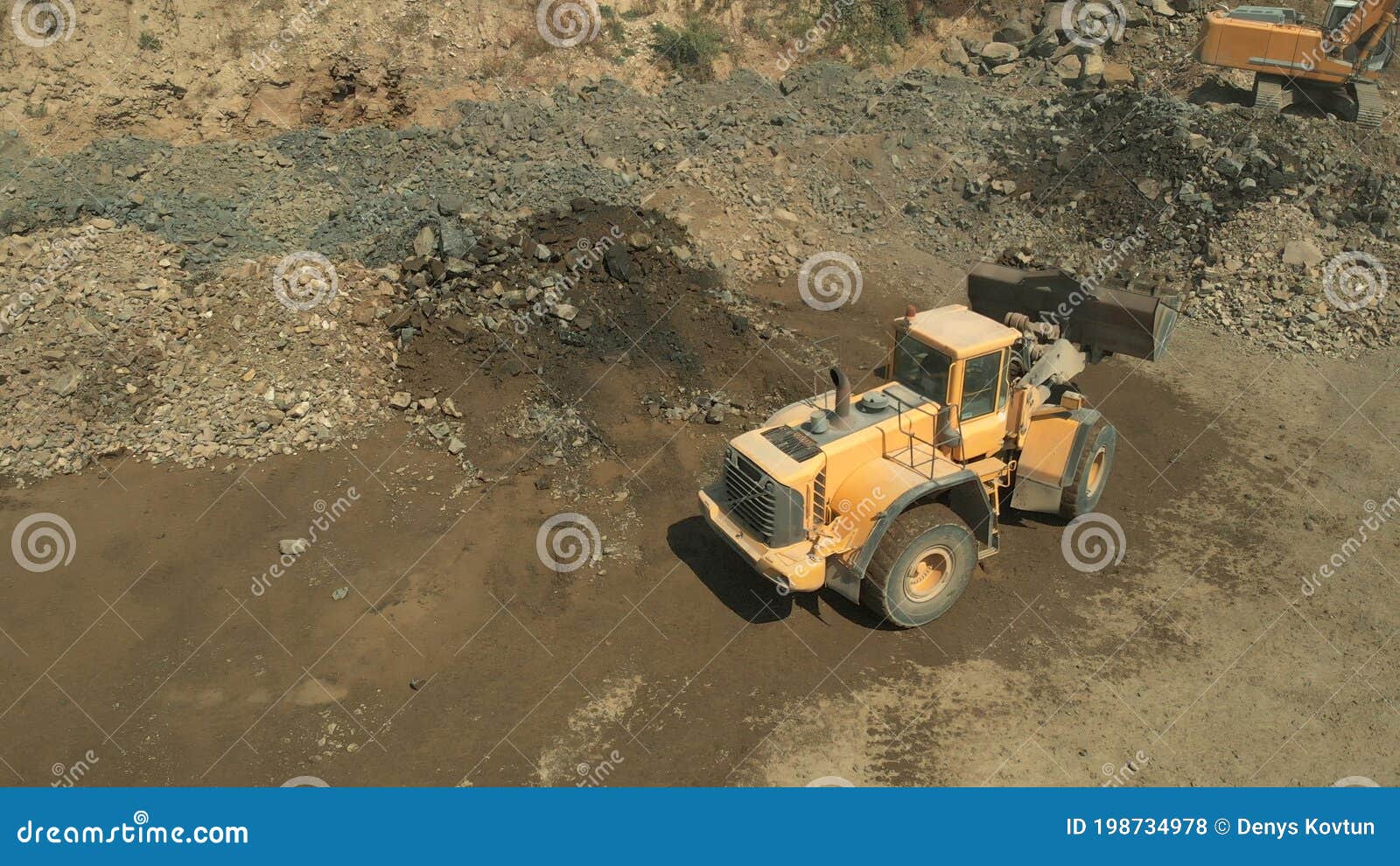 Earthmoving Machine for Excavation and Dumping of Soil. Stock Photo ...