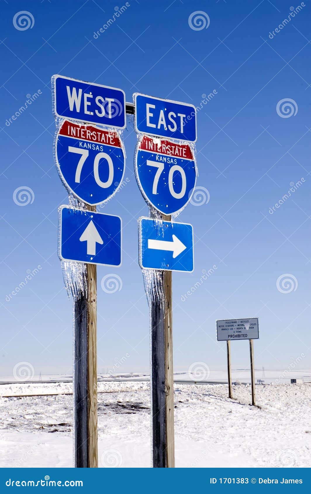 East and West I-70 Signs with Icicles Stock Image - Image of west, east ...