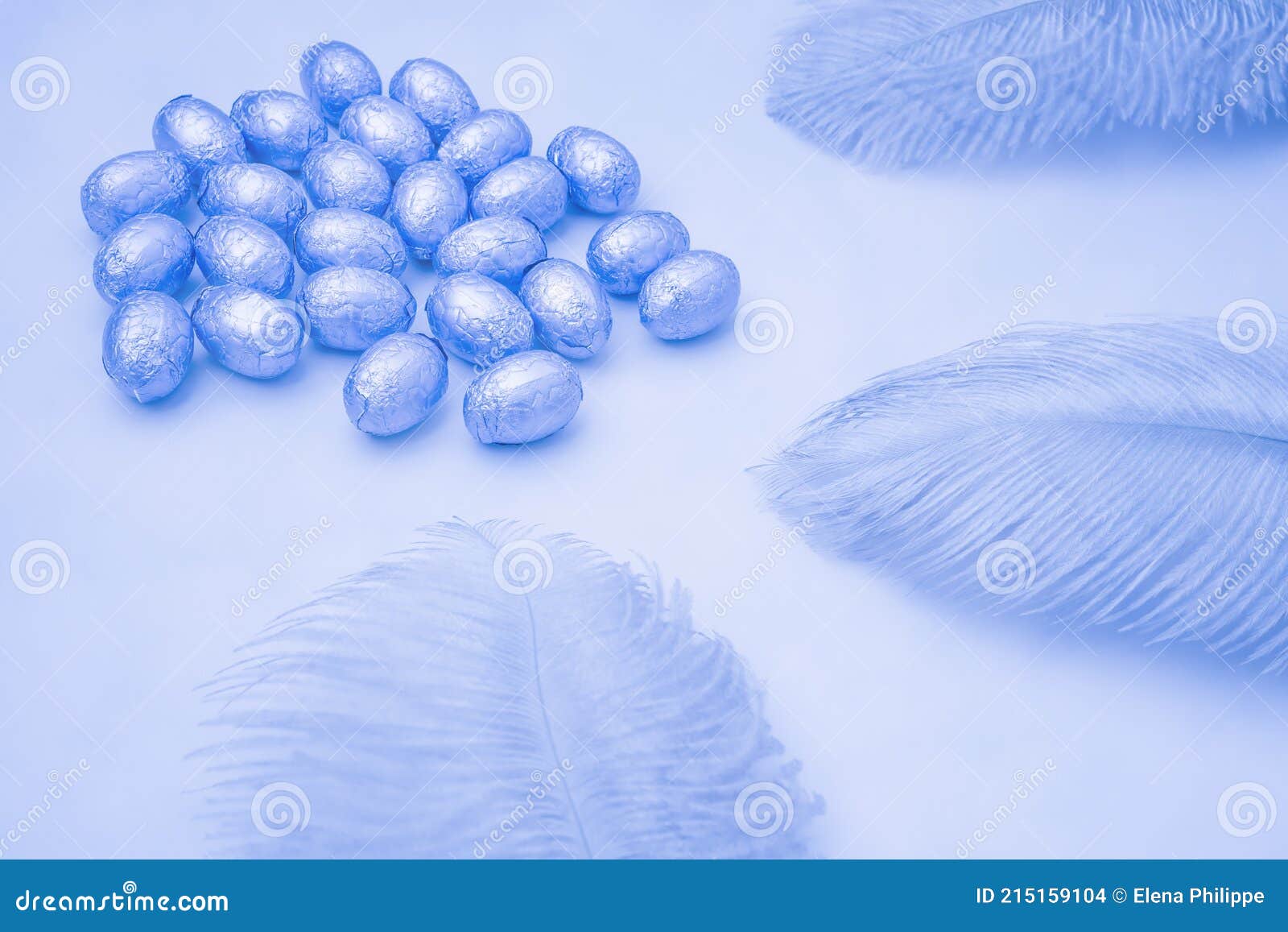 Easter Blue Light Background with Chocolate Easter Eggs Wrapped in Foil ...