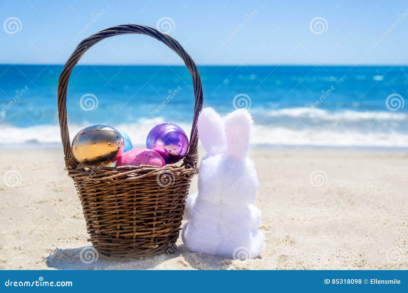 Easter Bunny with Basket and Color Eggs on the Ocean Beach Stock Photo ...