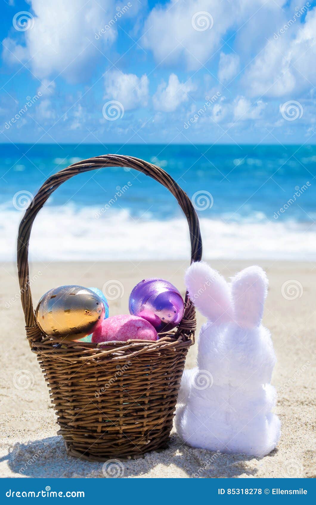 Easter Bunny with Basket and Color Eggs on the Ocean Beach Stock Photo ...