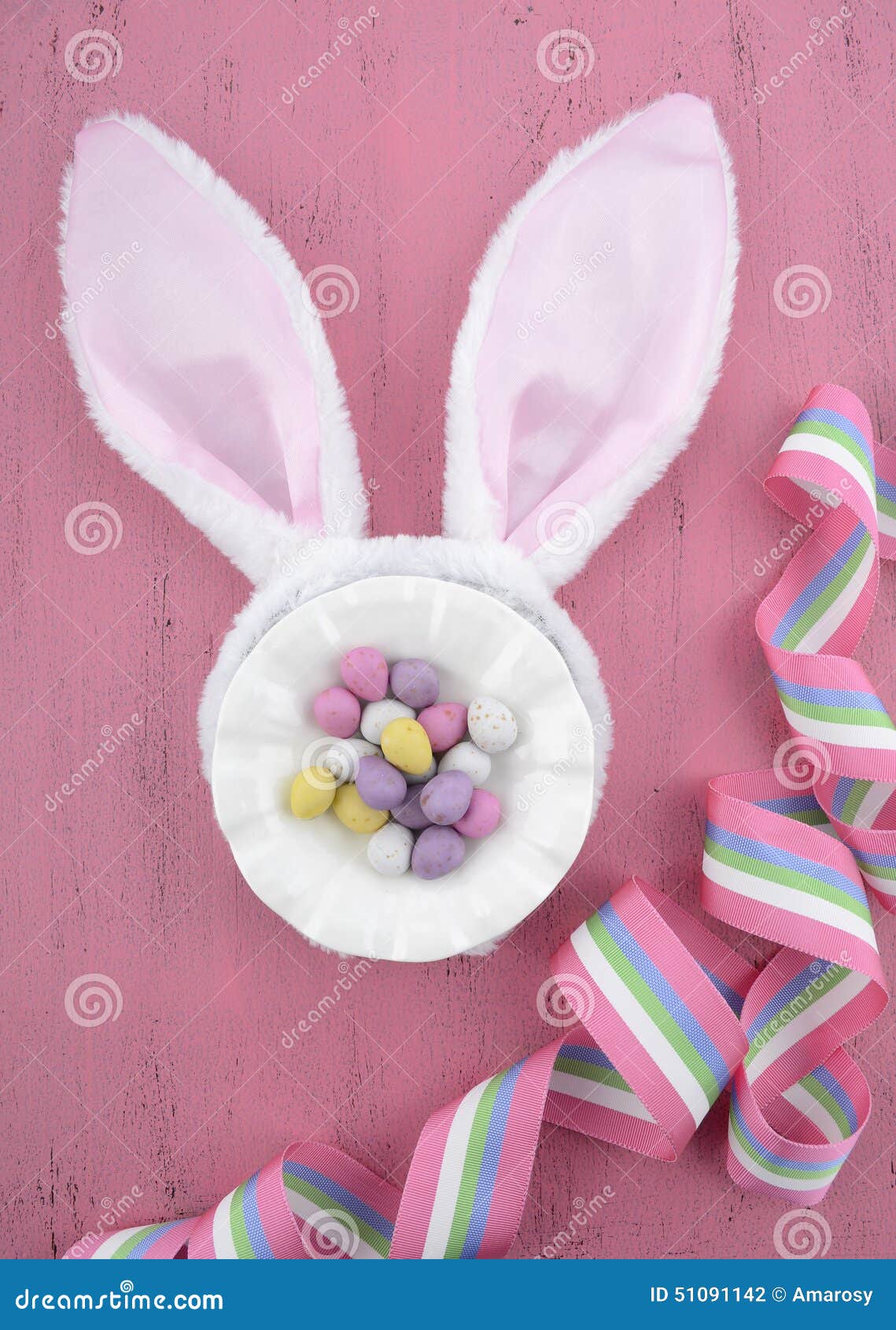 Easter Bunny Ears with Easter Eggs on Pink Wood - Vertical Stock Photo ...