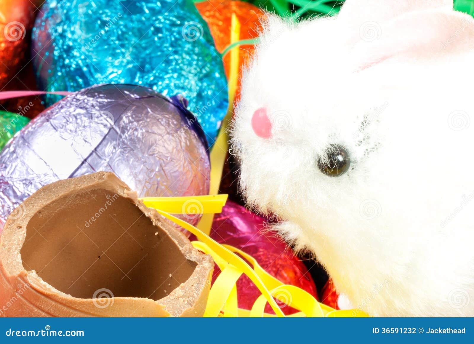 Easter Bunny Eats Egg stock photo. Image of colorful - 36591232
