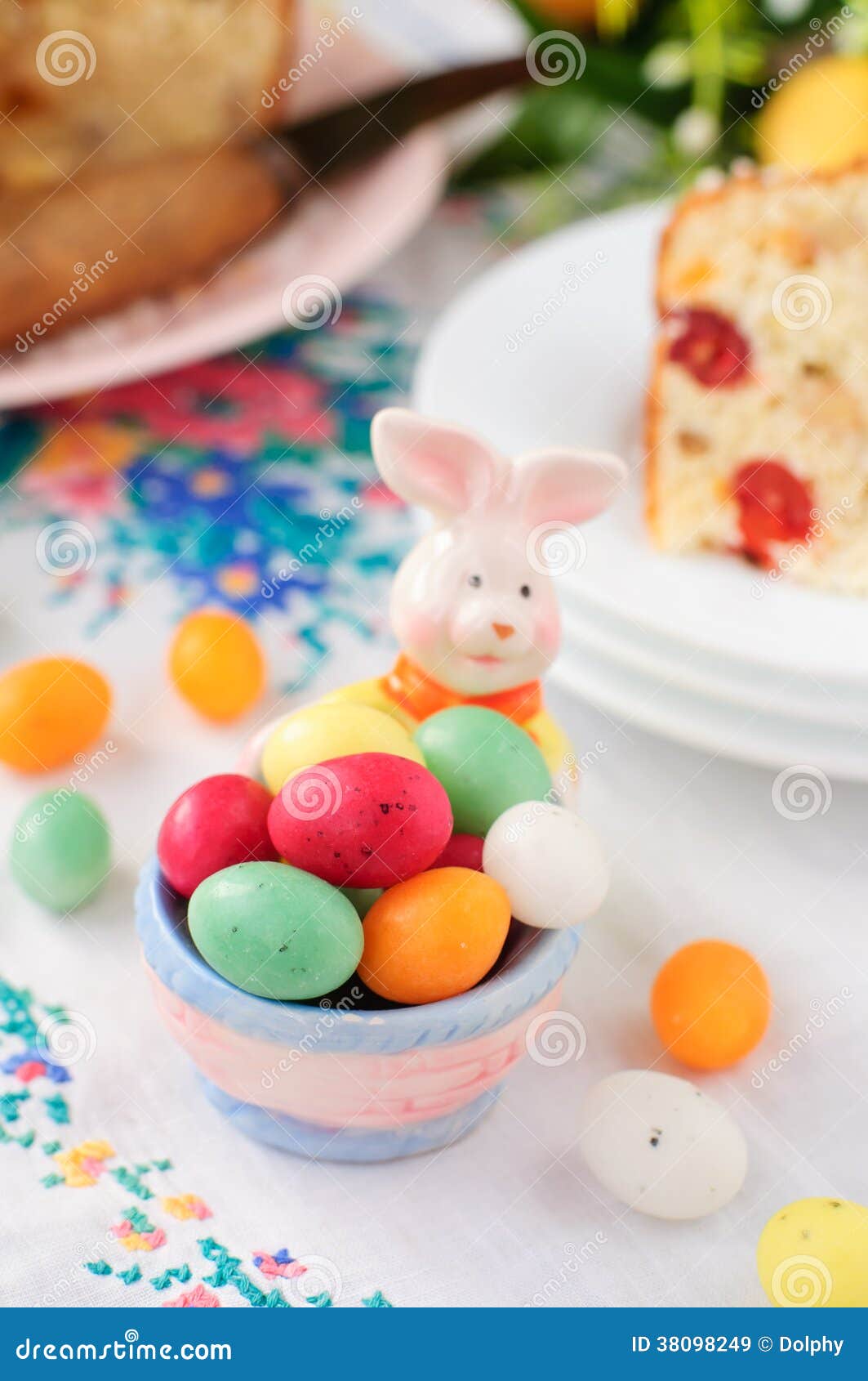 Easter Bunny Egg Holder Filled with Colorful Spotted Egg-Shaped Stock ...