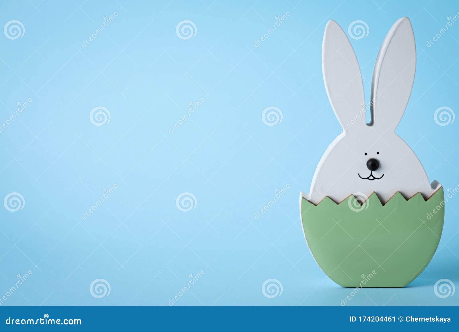 Easter Bunny Figure on Light Blue Background. Space for Text Stock ...