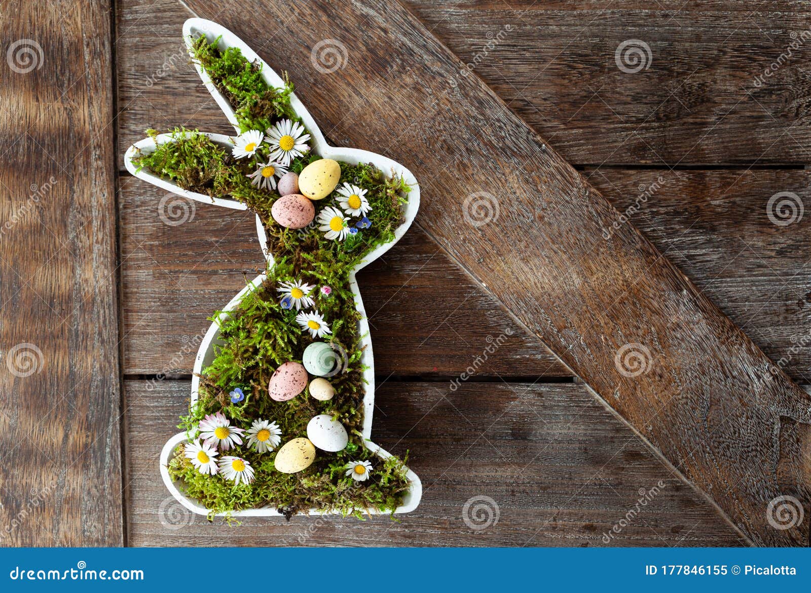 Easter bunny with flowers stock image. Image of eggs - 177846155