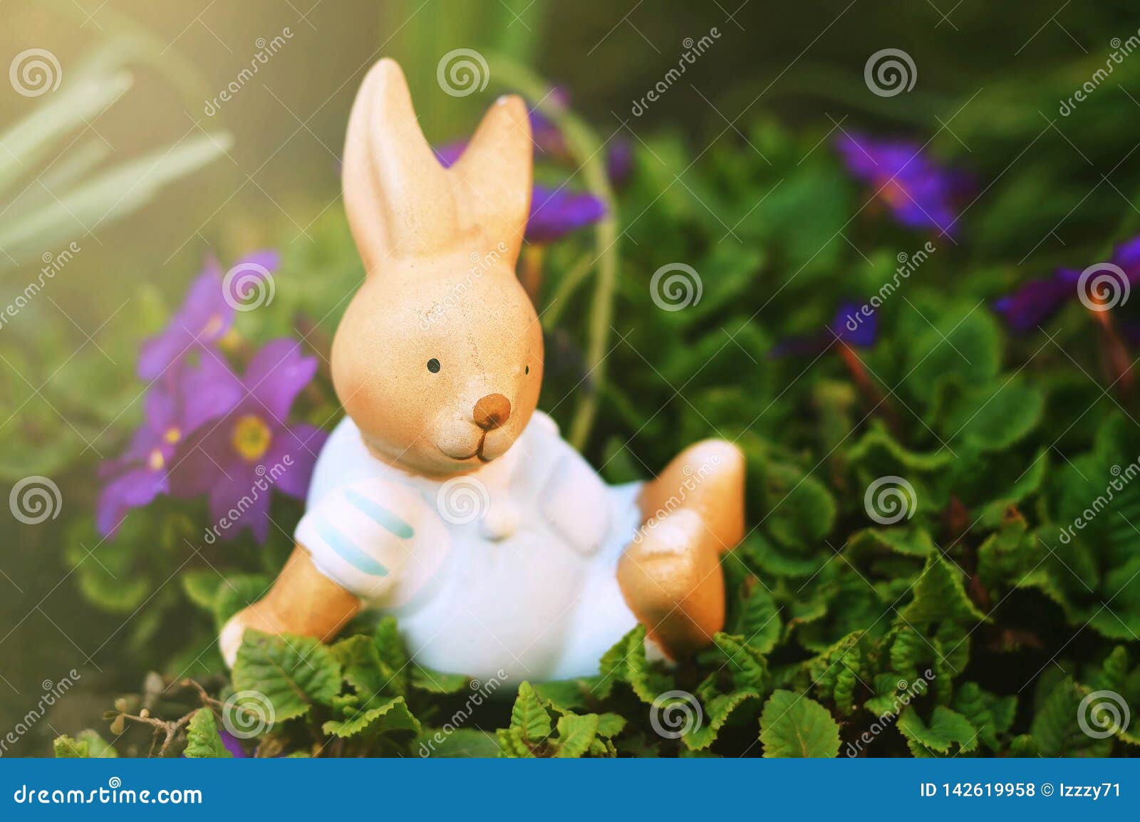 Easter bunny in the garden stock photo. Image of traditional - 142619958