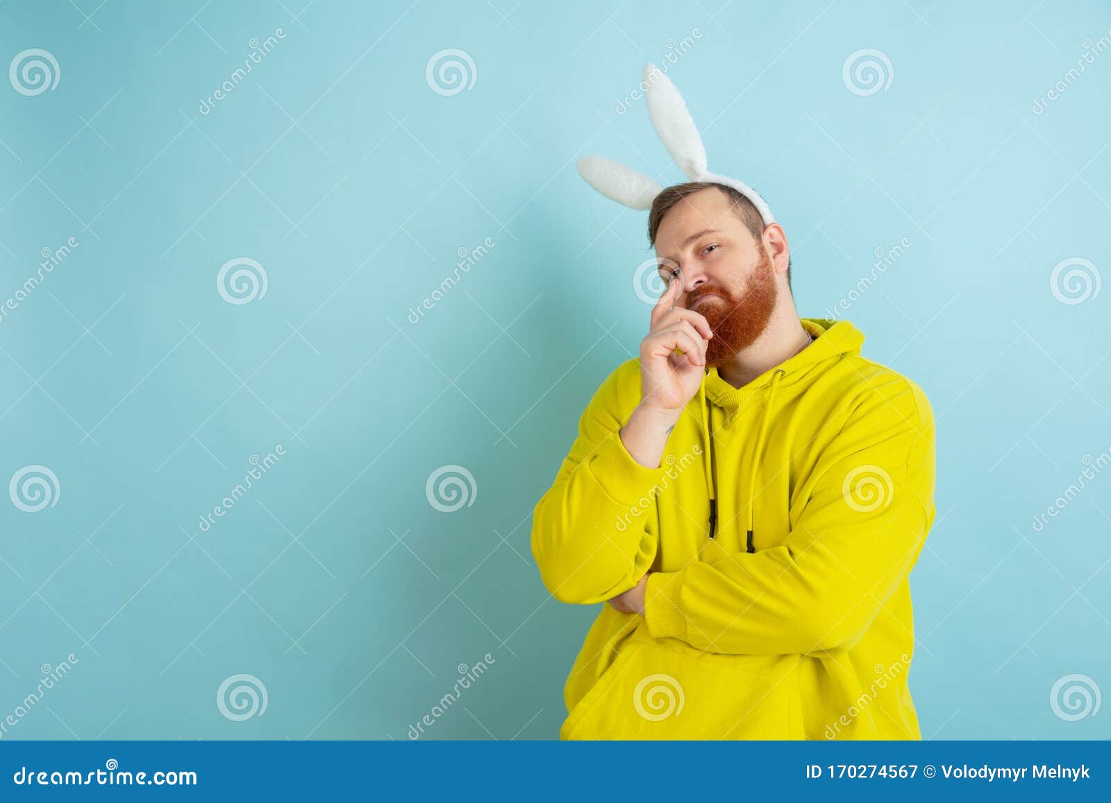 Easter Bunny Man with Bright Emotions on Blue Studio Background Stock ...