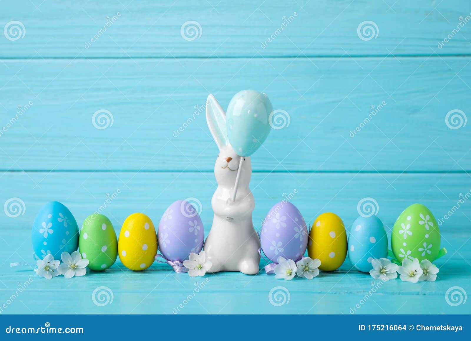 Easter Bunny and Painted Eggs on Light Blue Wooden Background Stock ...