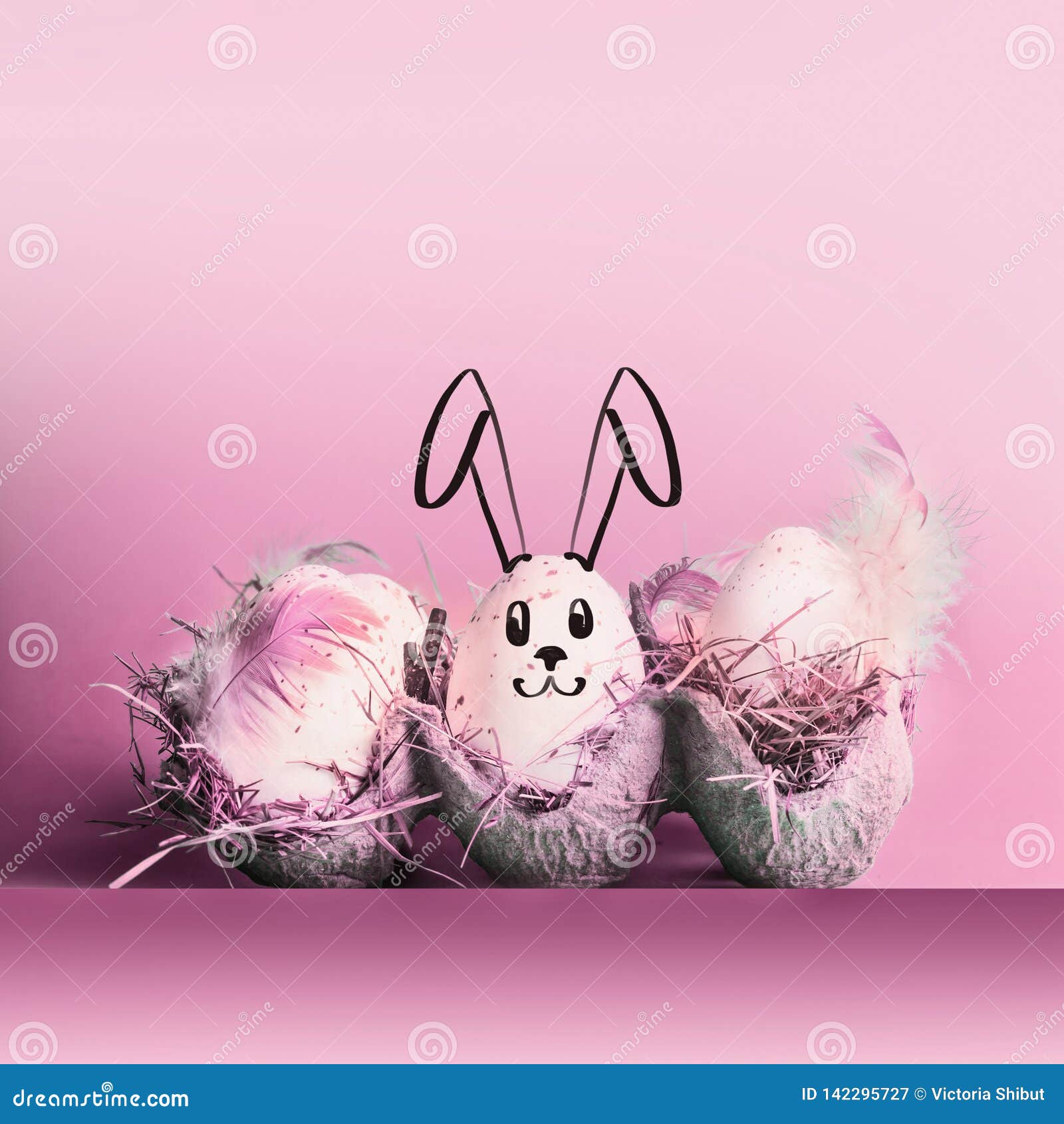 Easter Bunny Rabbit Painted on Eggs at Pastel Pink Background Stock ...