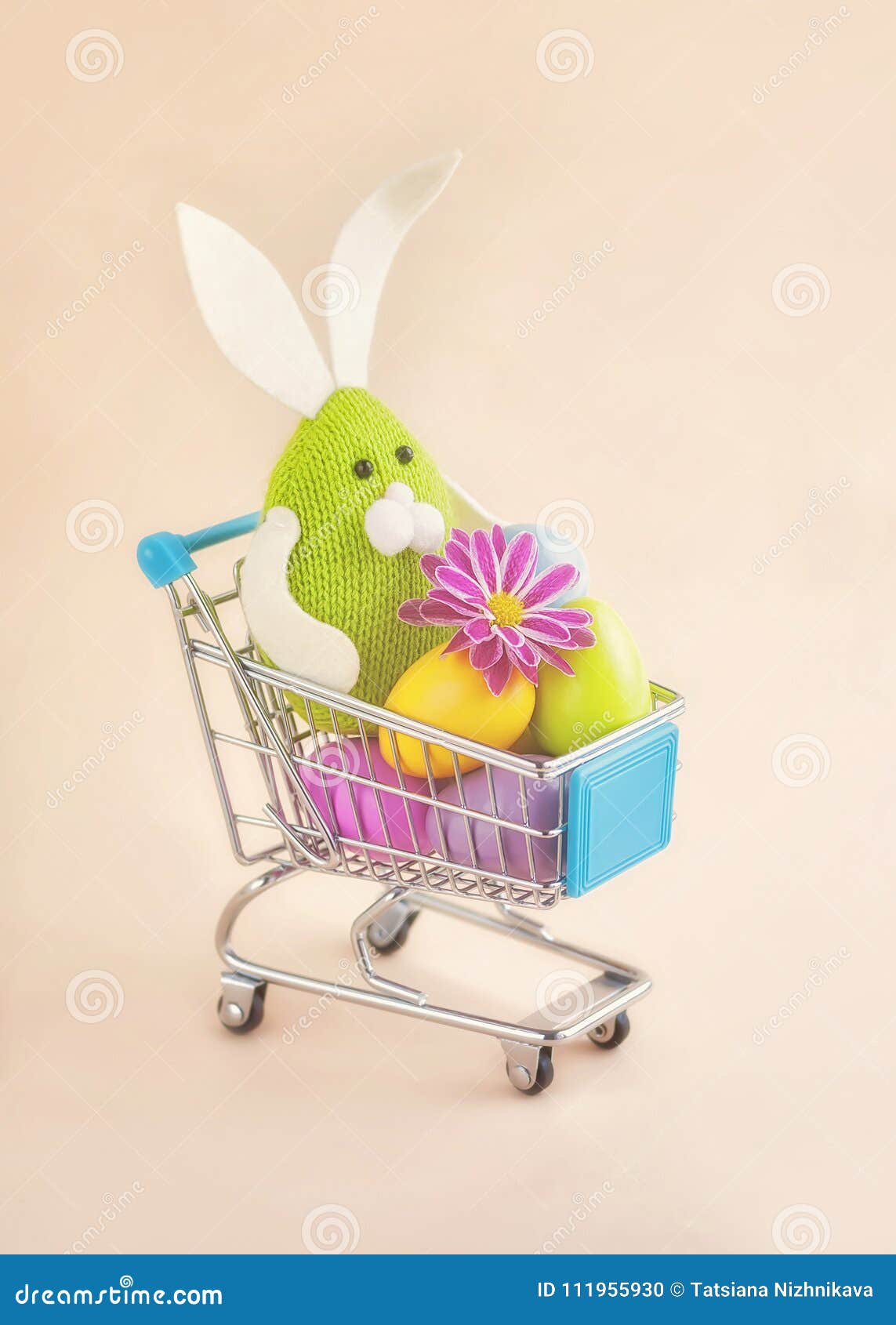 Easter Bunny in a Shopping Trolley with Colored Eggs and a Flower ...