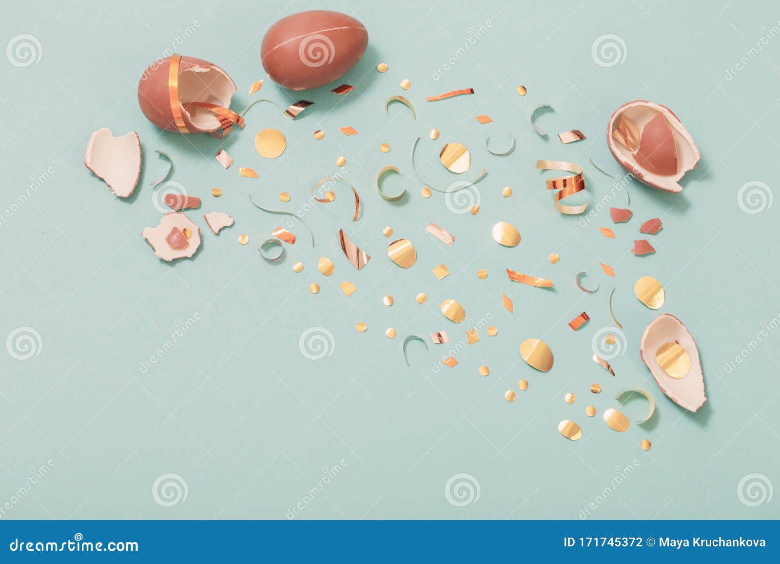 Easter Chocolate Egg with Confetti on Blue Mint Paper Background Stock ...