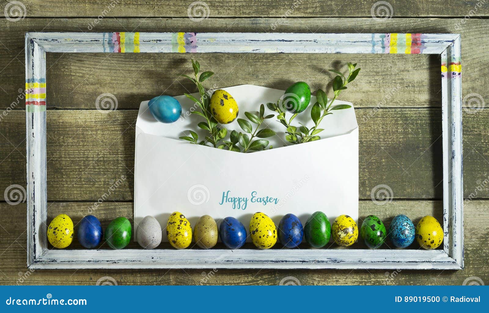Easter Colored Eggs in a Postal Envelope on a Wooden Background Stock ...