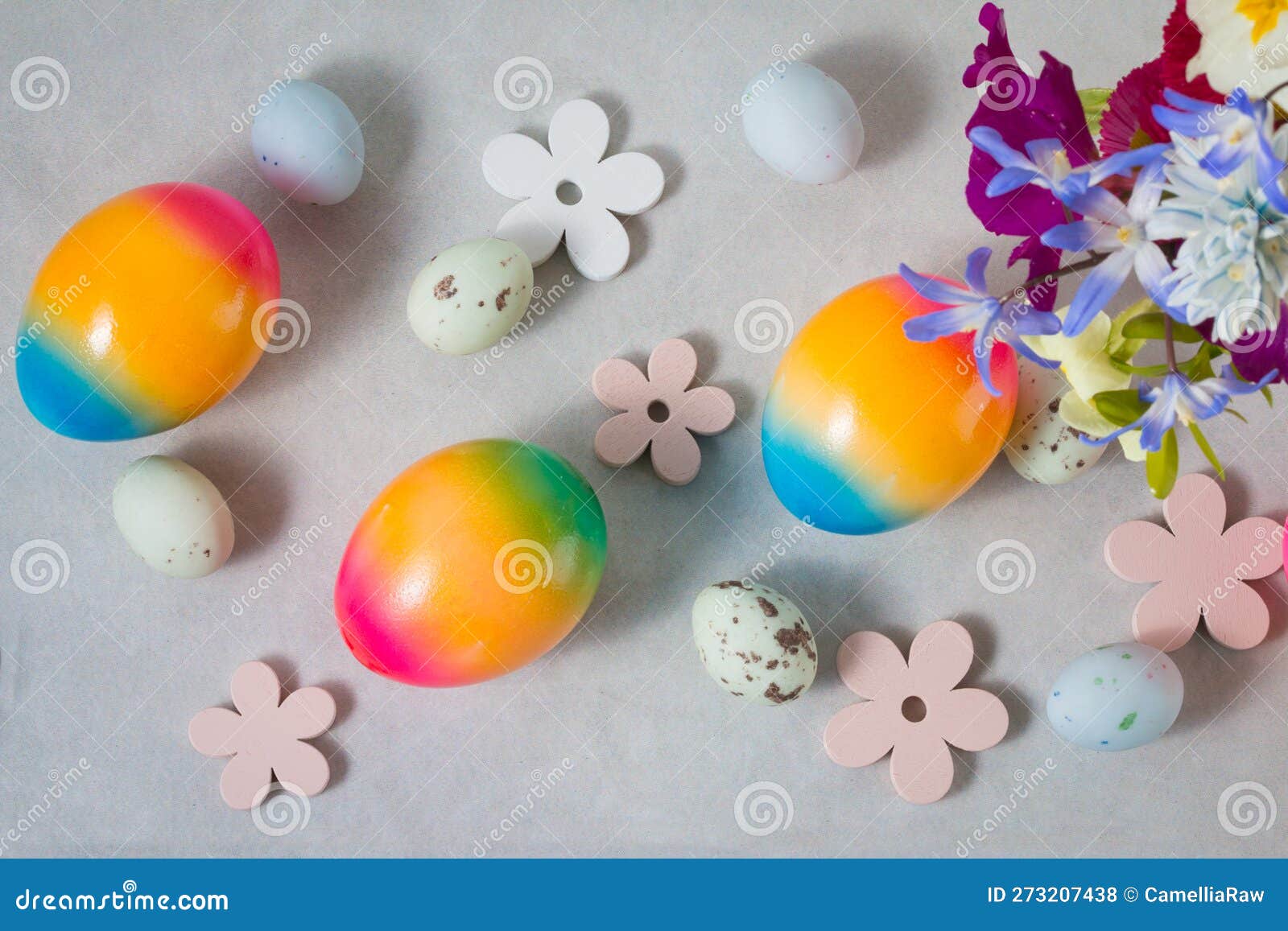Easter Colored Rainbow Eggs With Spring Flowers, Top View On Gray ...