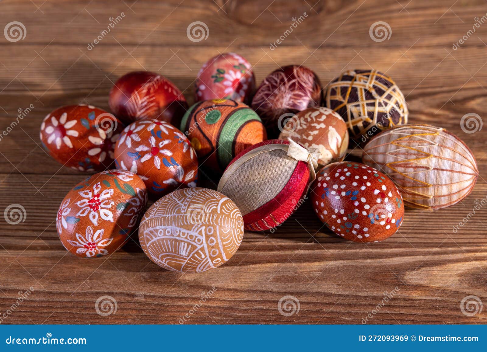 A Collection of Easter Eggs with Brown Colors Lying on Old Boards ...