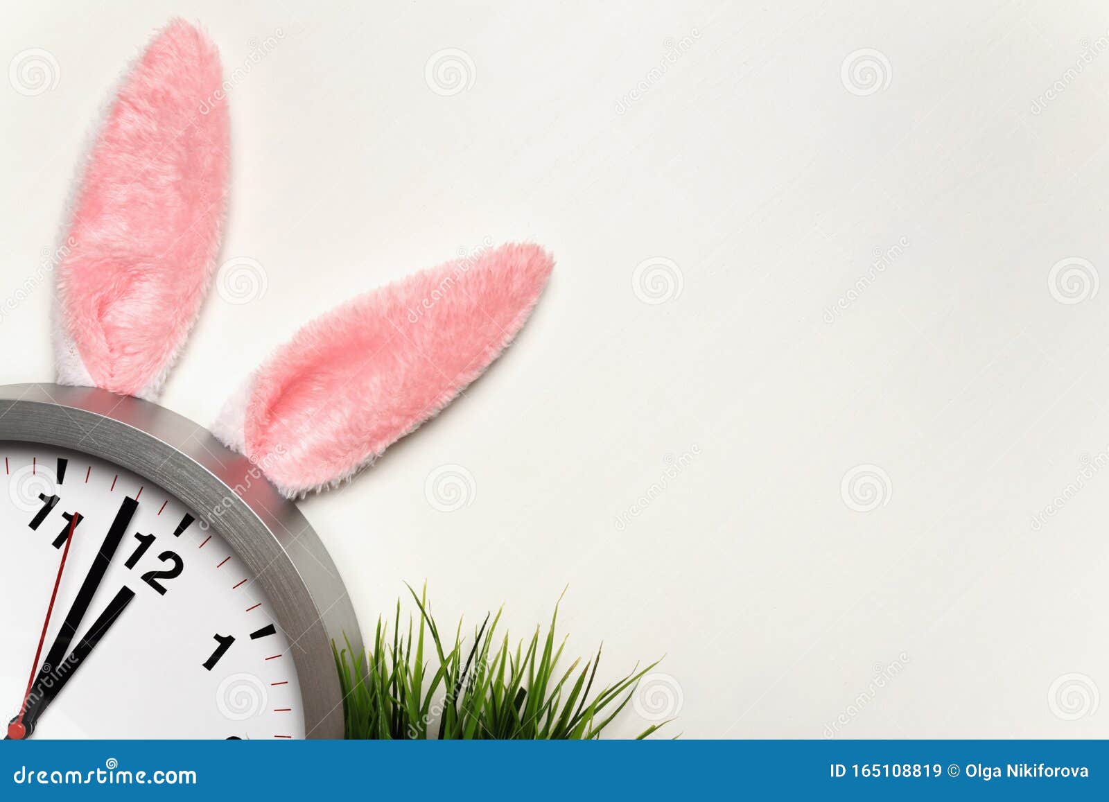 Easter Concept. Clock with Bunny Ears and Green Grass on a White ...