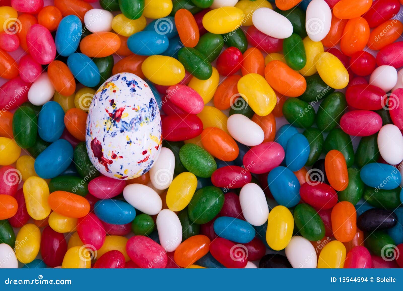 Easter egg on jellybeans stock photo. Image of paint - 13544594
