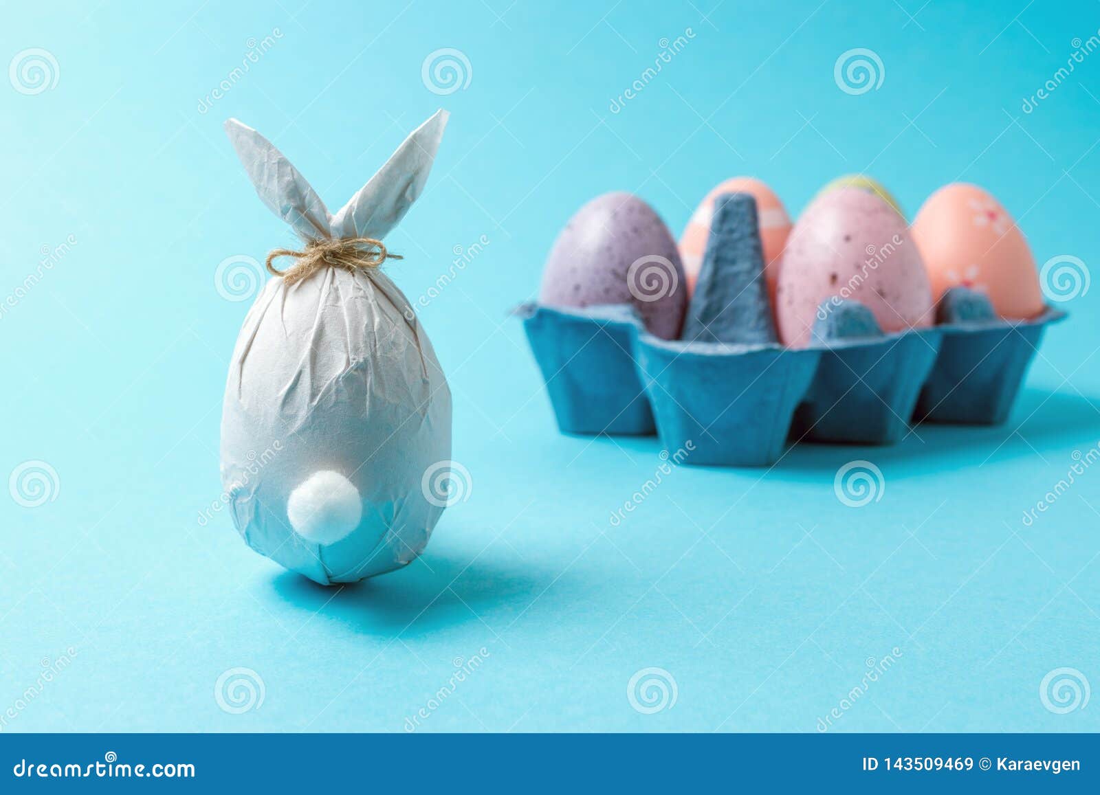 Easter Egg Wrapped in a Paper in the Shape of a Bunny with Colorful ...