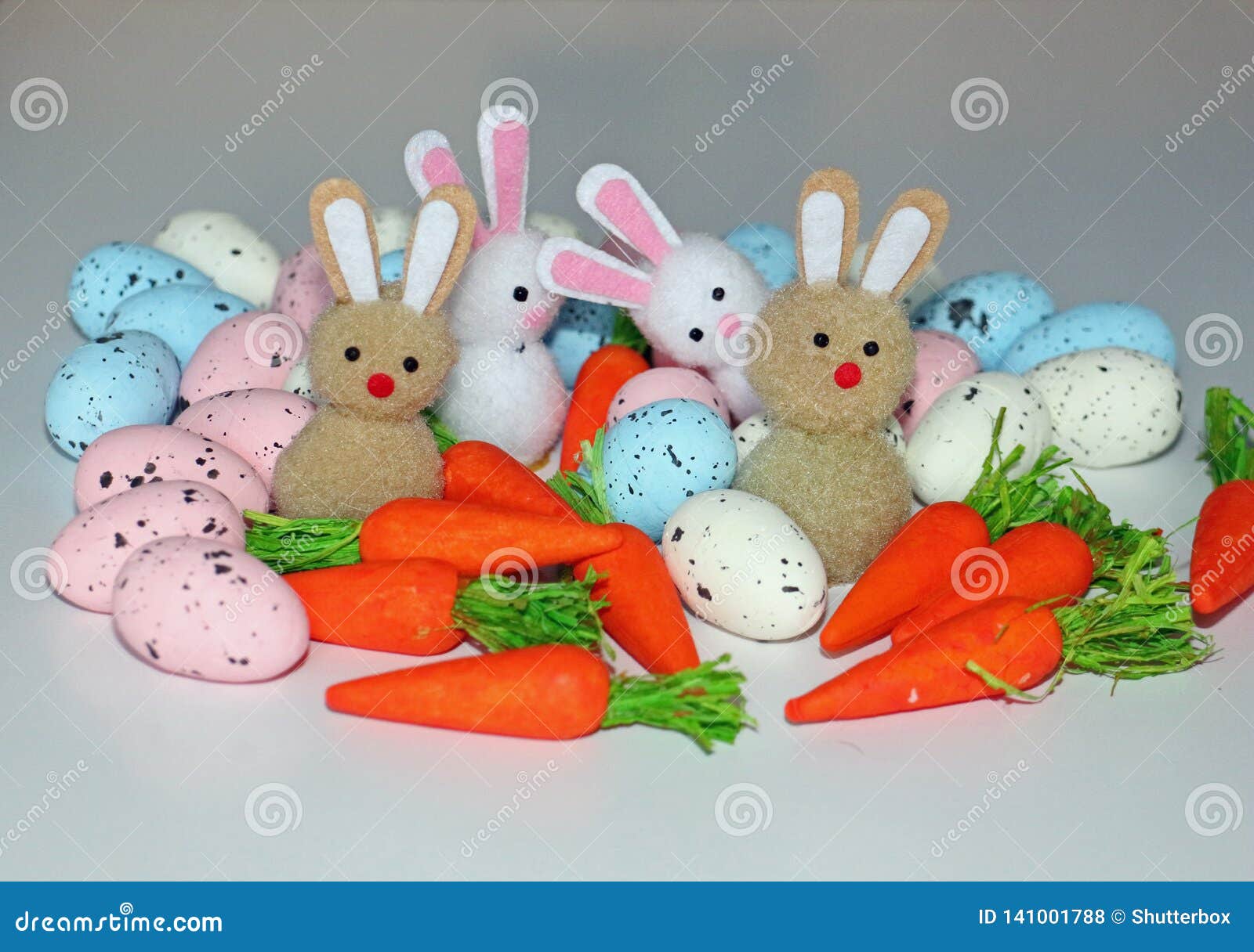 Easter Eggs Carrots and a Group of Bunnies Stock Photo - Image of ...