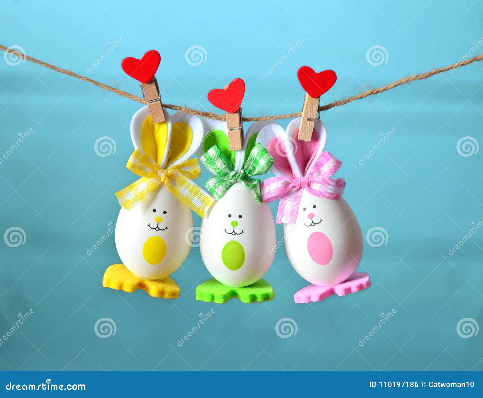 Easter Eggs Hanging on Rope on Blue Background Stock Photo - Image of ...