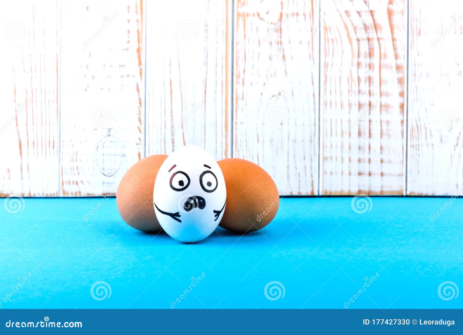 Easter Eggs with Scared Face on Blue and White Wooden. Stock Photo ...