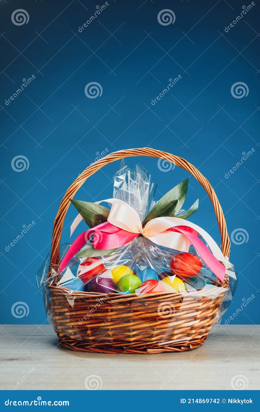 Easter Gift Basket with Multicolor Eggs, Blue Background Stock Photo ...