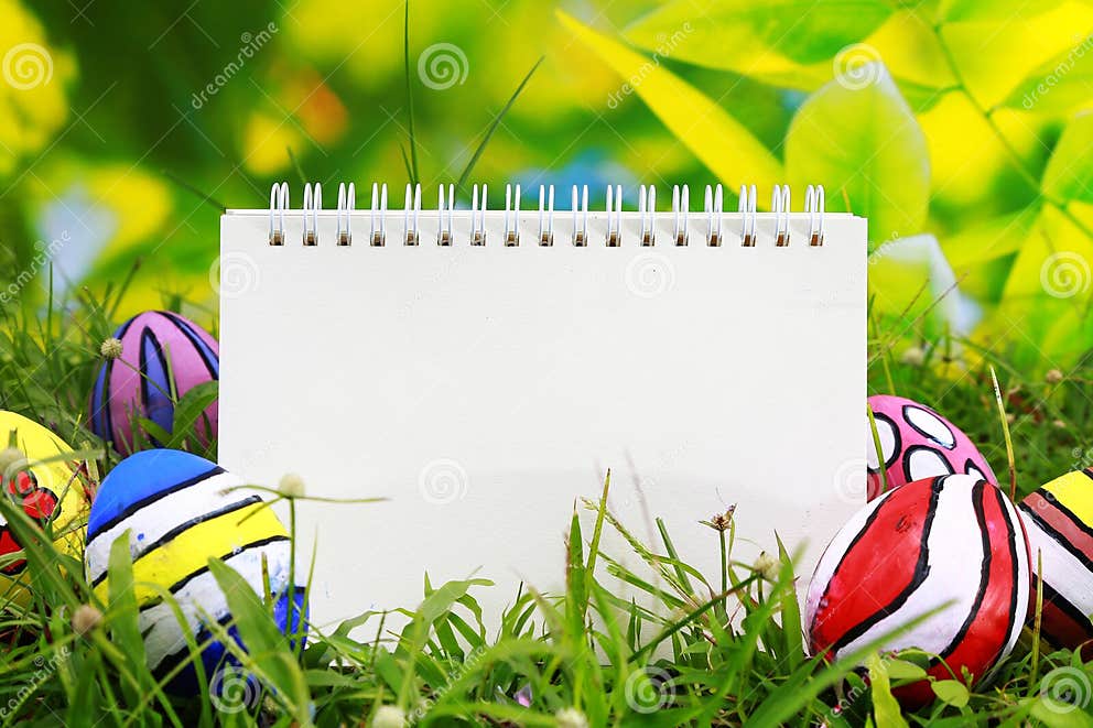 Easter Painted Colorful Eggs and a Notepad Blank Stock Photo - Image of ...