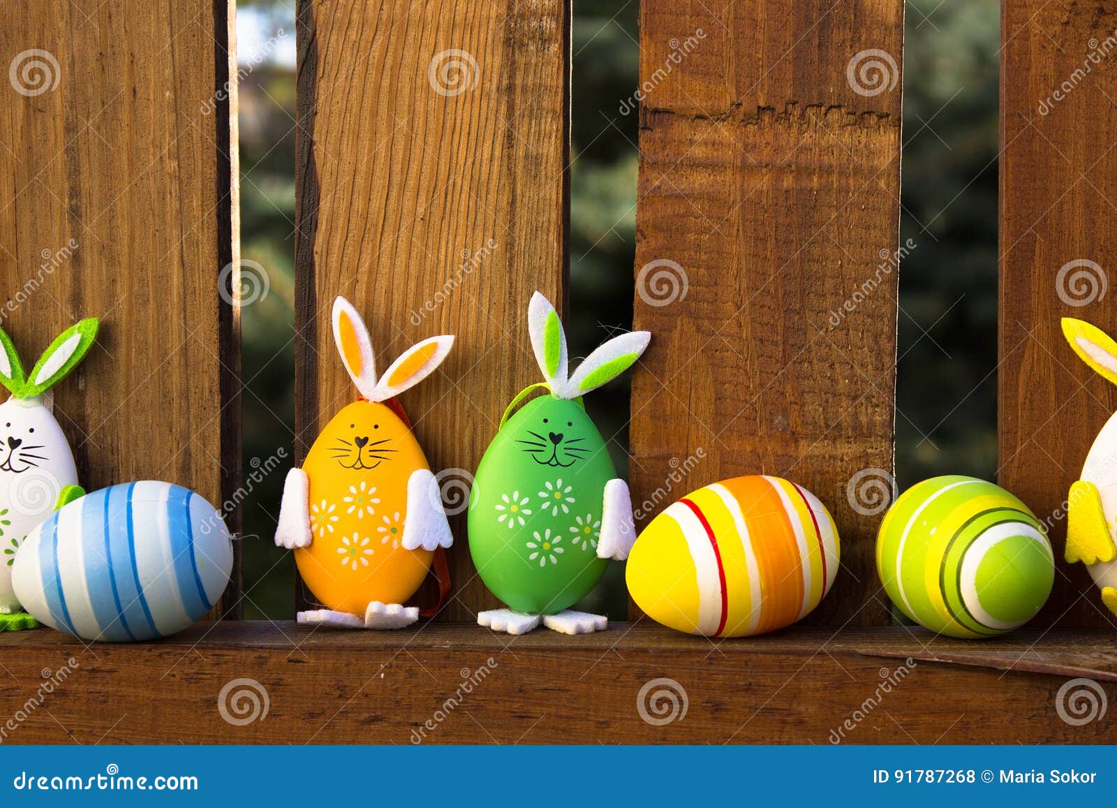 Easter Rabbits Bunny and Eggs on the Fence Stock Photo - Image of nest ...