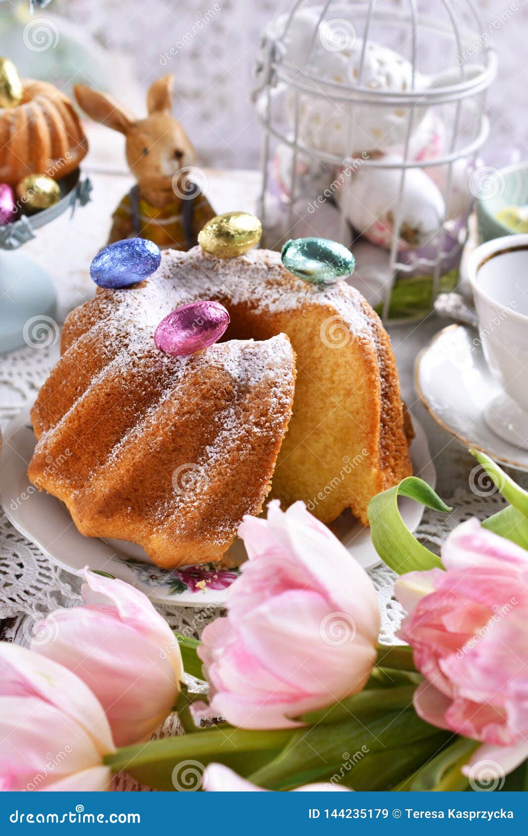 Easter Ring Cake with Powdered Sugar on Festive Table Stock Image ...