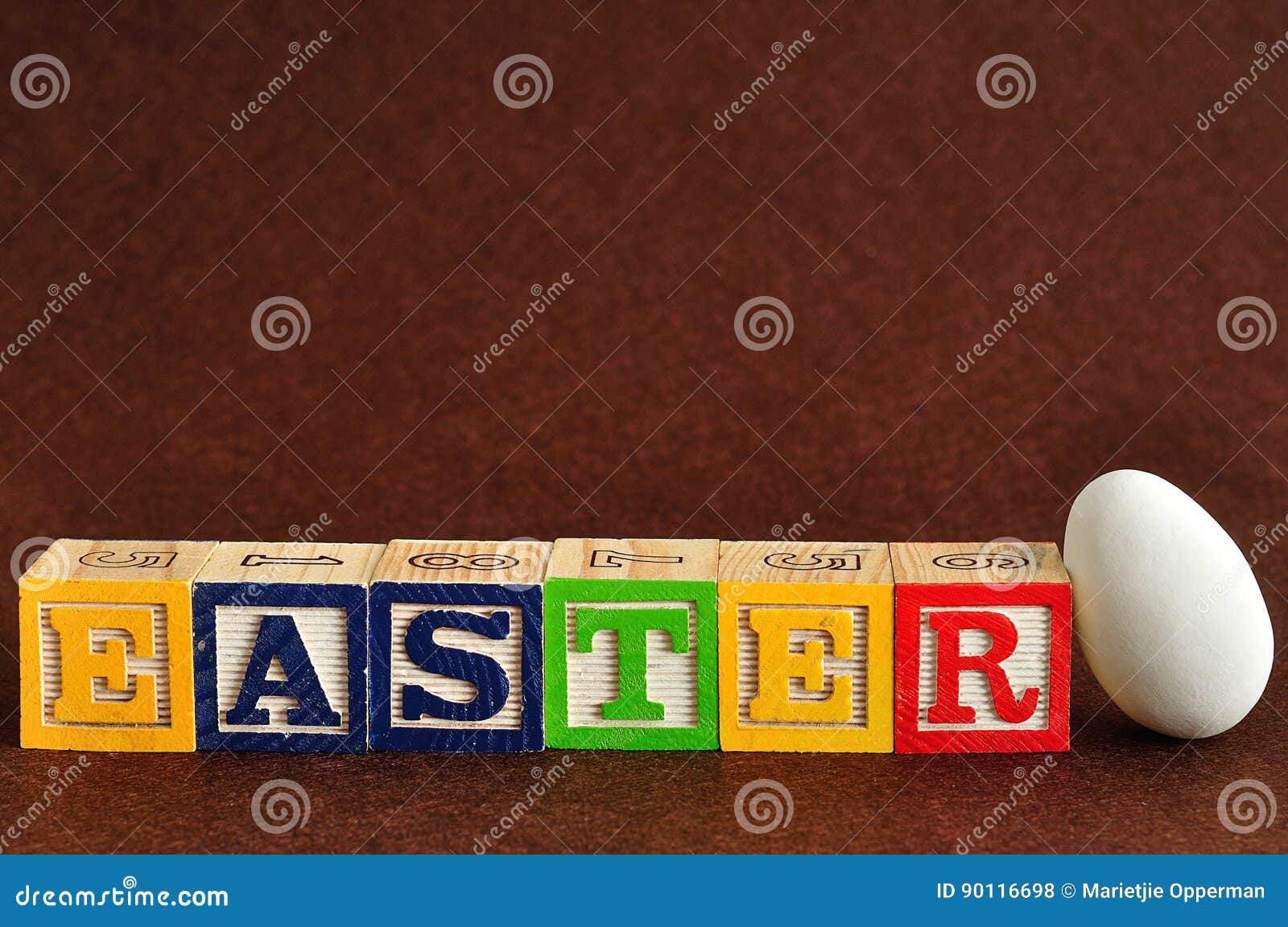 Easter Spelled with Alphabet Blocks and a Easter Egg Stock Photo ...