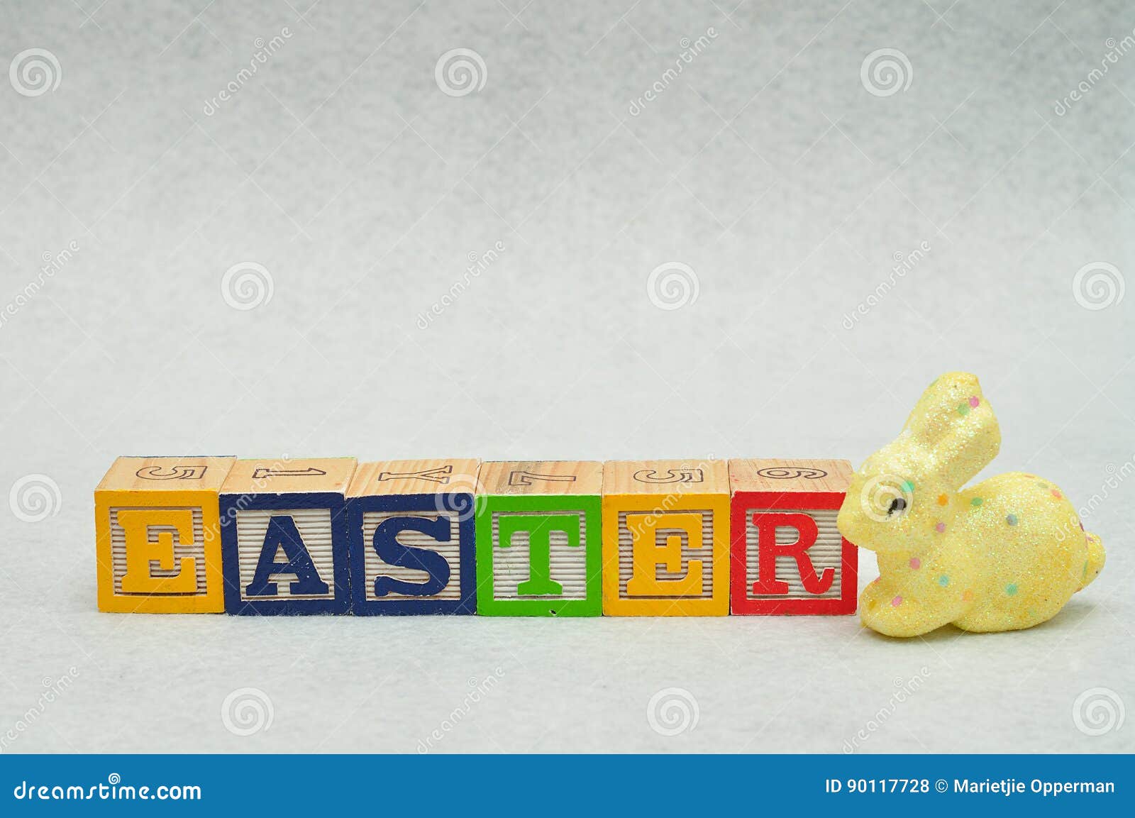 Easter Spelled with Alphabet Blocks and a Yellow Bunny Stock Photo ...
