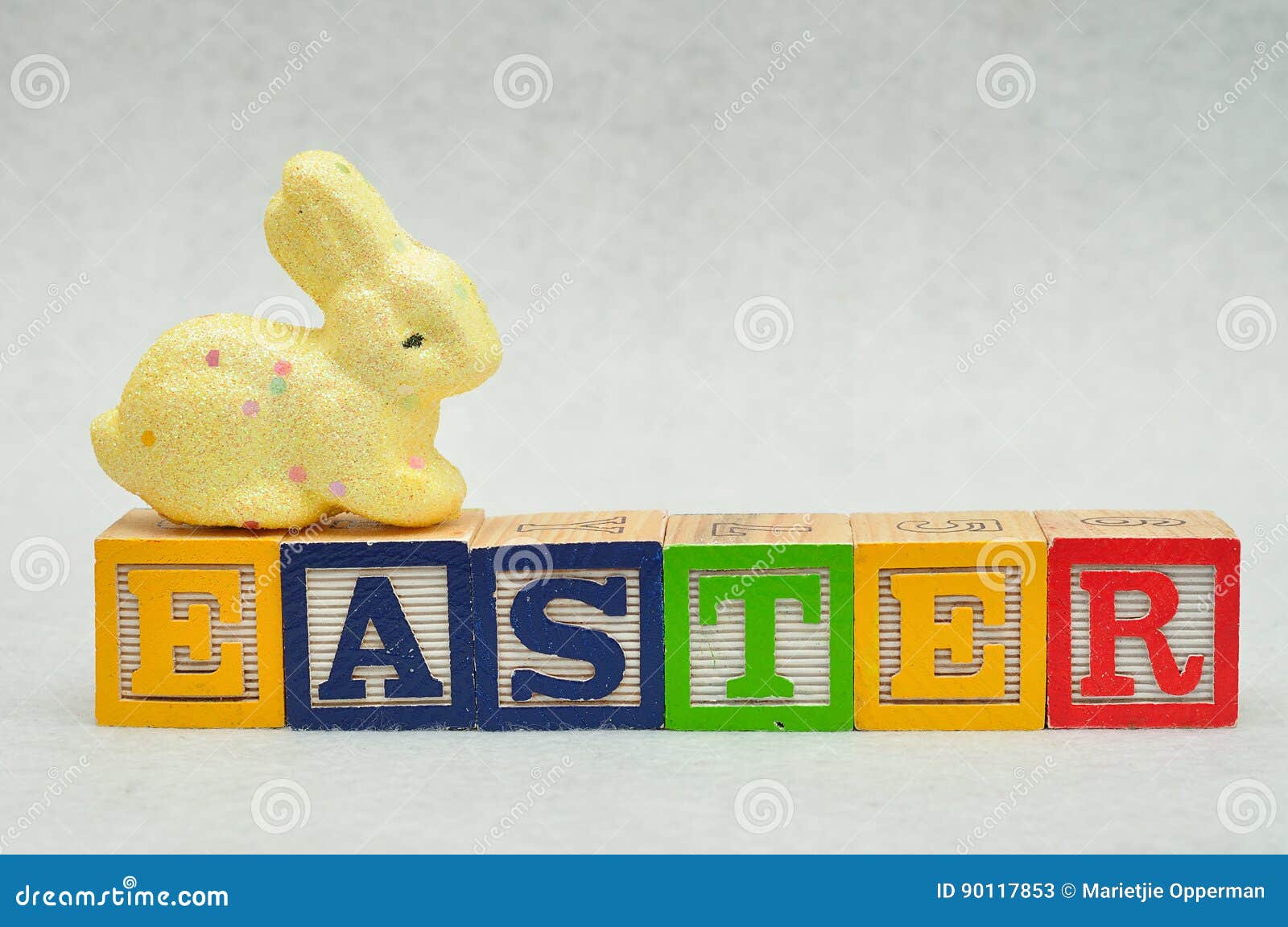Easter Spelled with Alphabet Blocks and a Yellow Bunny Stock Image ...