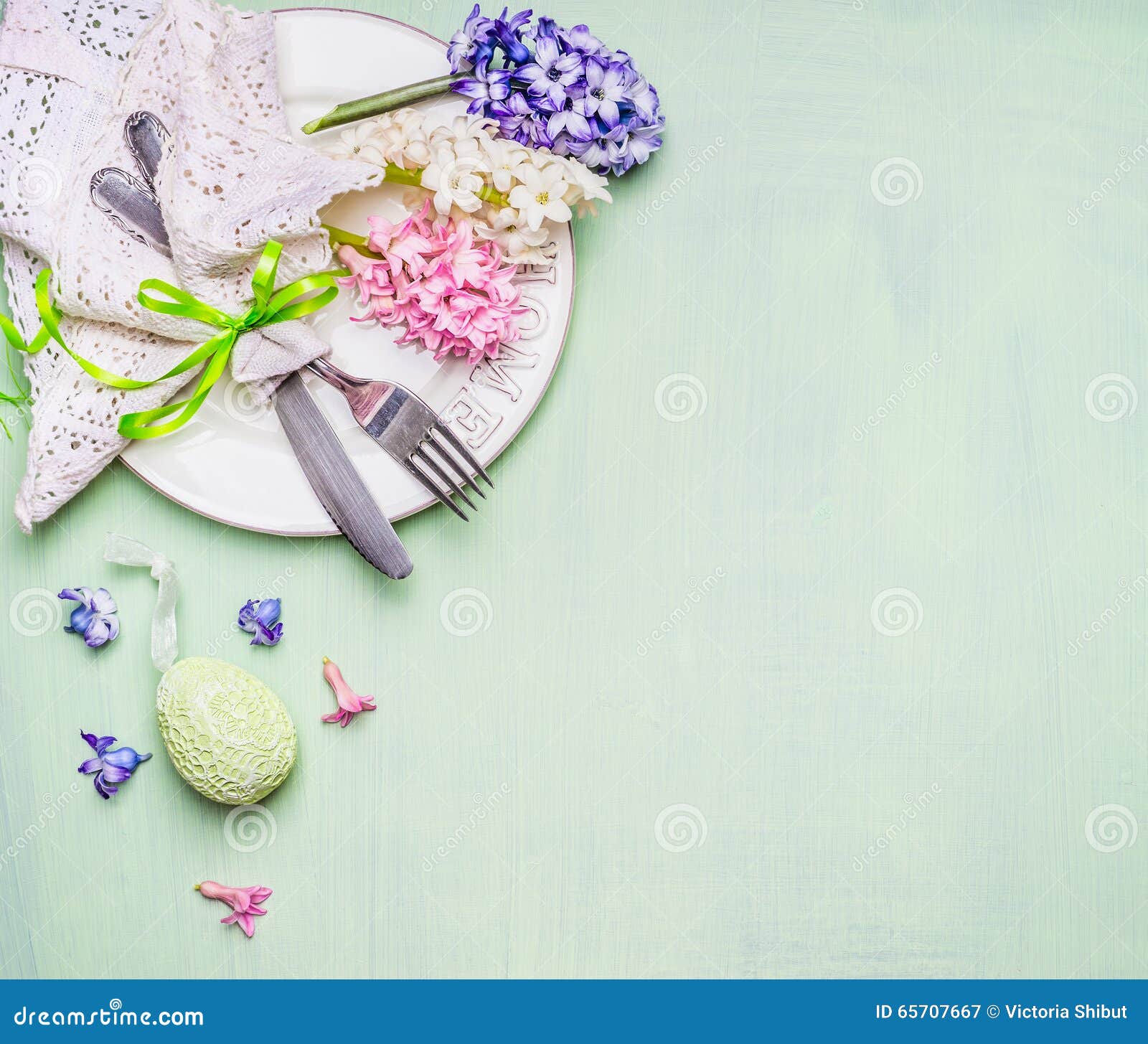 Easter Table Place Setting with Flowers and Egg on Light Green ...