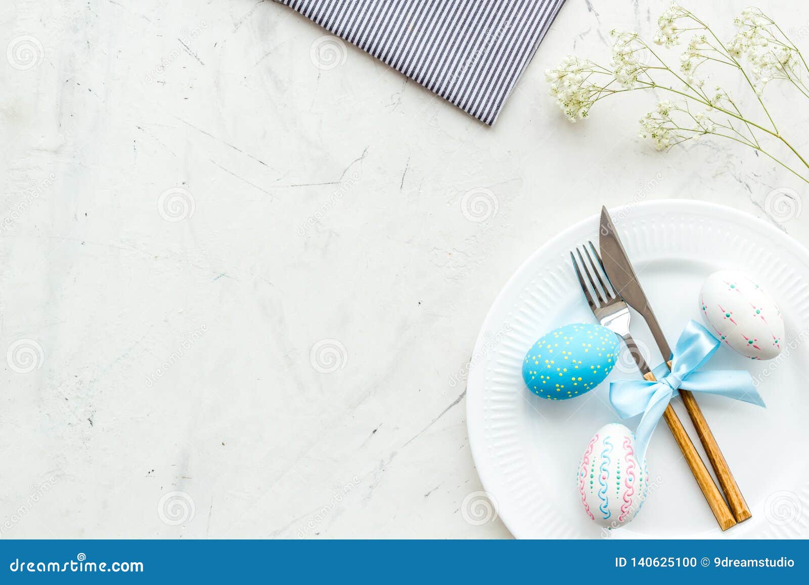 Easter Table Setting. Tableware and Painted Eggs on White Stone ...