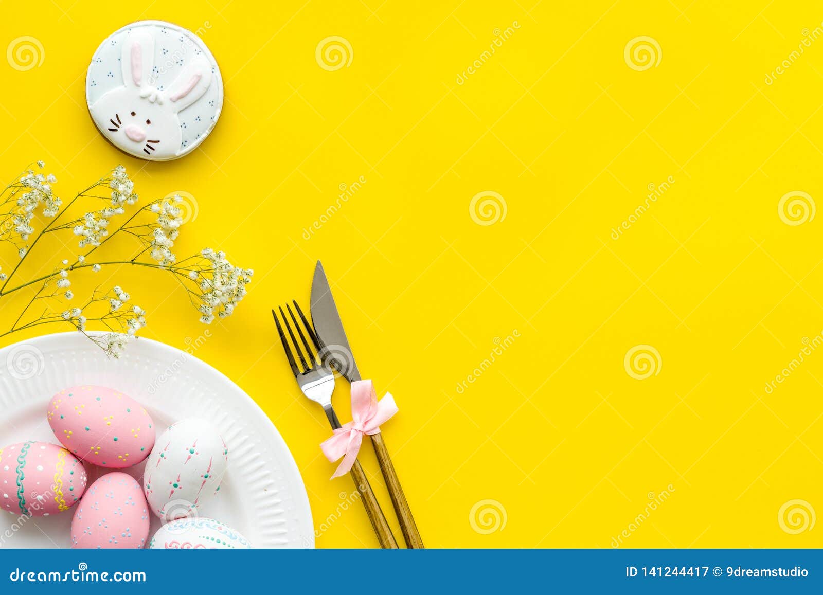 Easter Table Setting. Tableware and Painted Eggs on Yellow Background ...