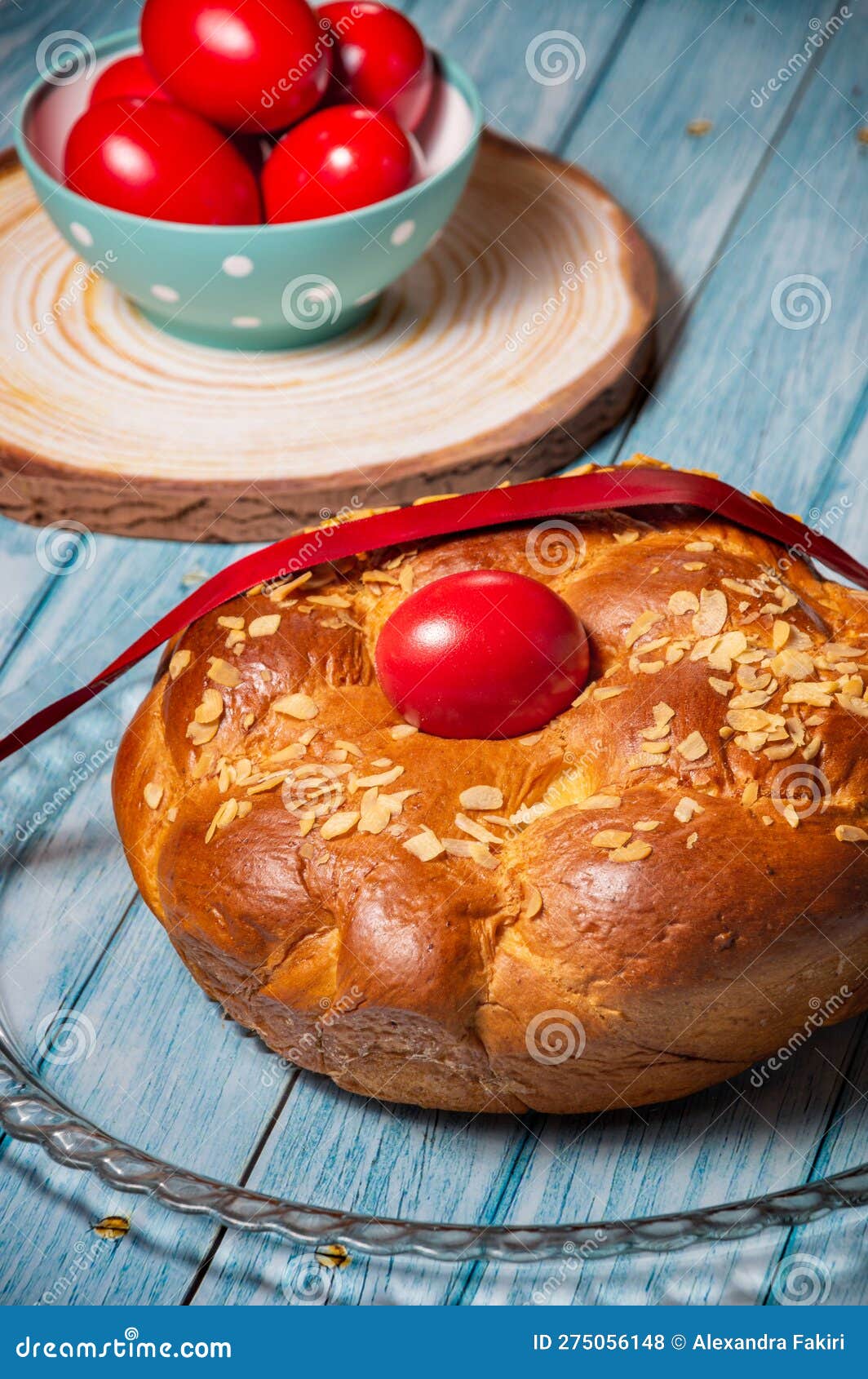 Easter Traditional Bread, Greek Tsoureki and Red Eggs on a Table Stock ...